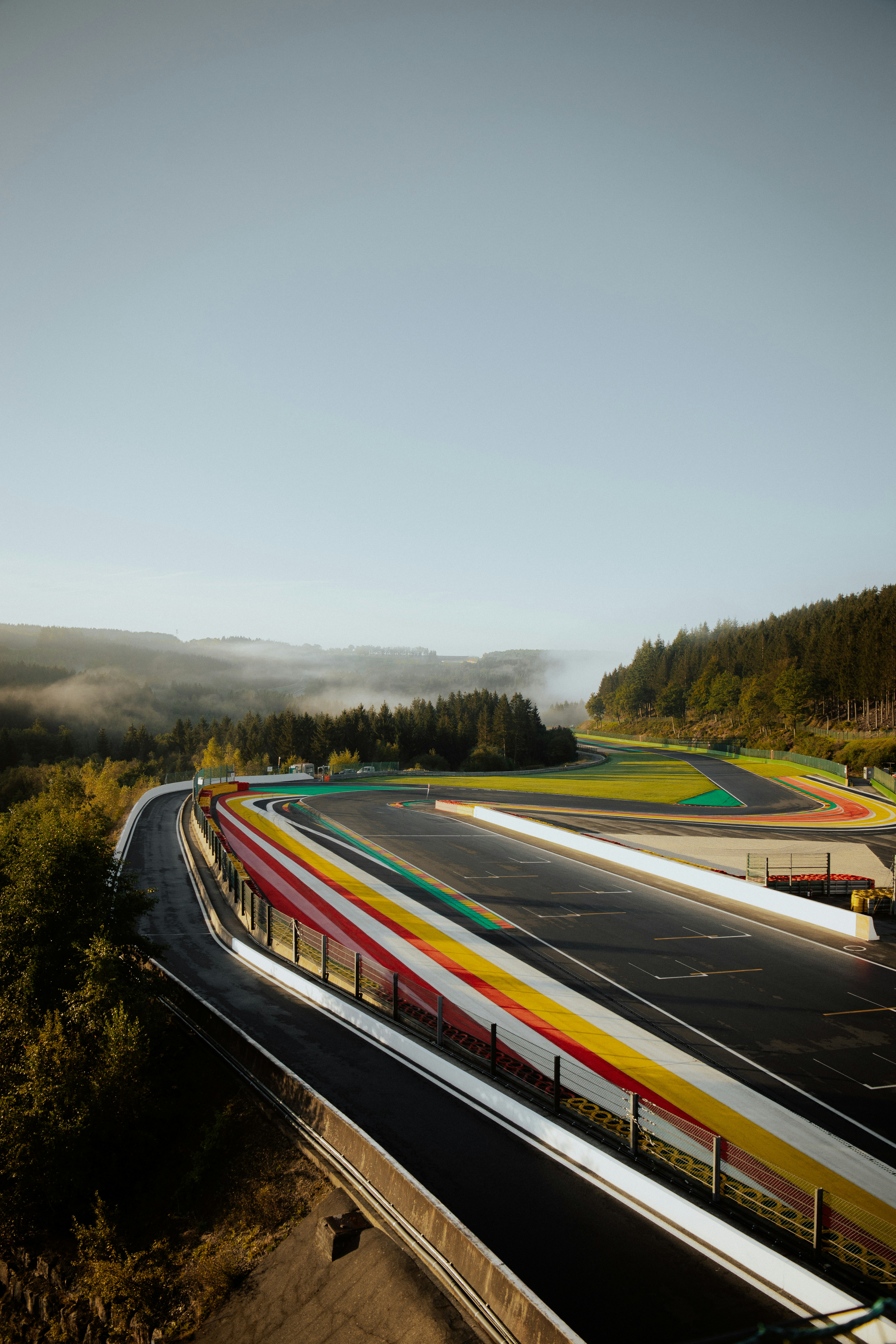 A race track is seen with colorful painted lines. photo – Free Cars ...
