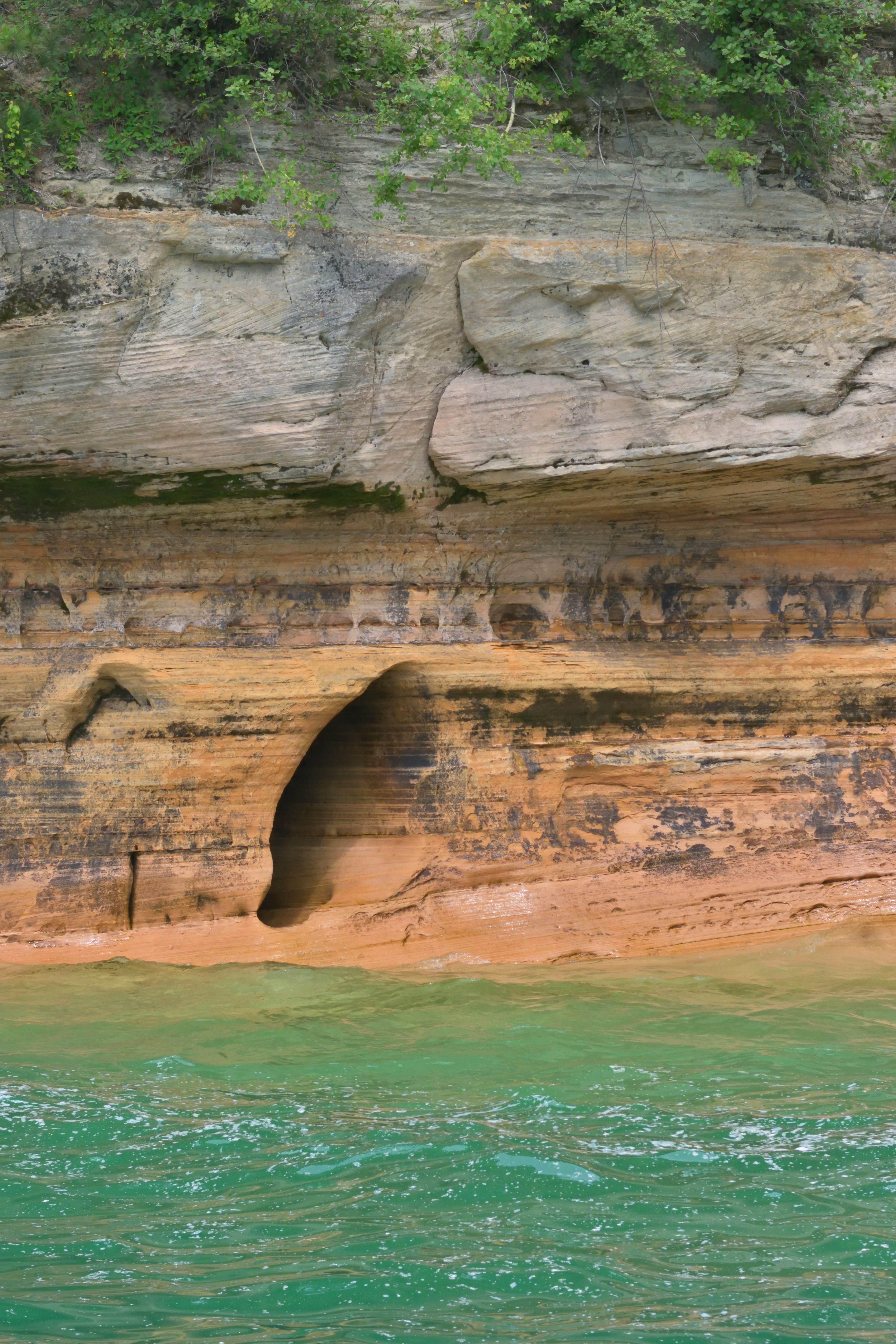 Colorful sandstone cliffs border the water. photo – Free Outdoor Image ...