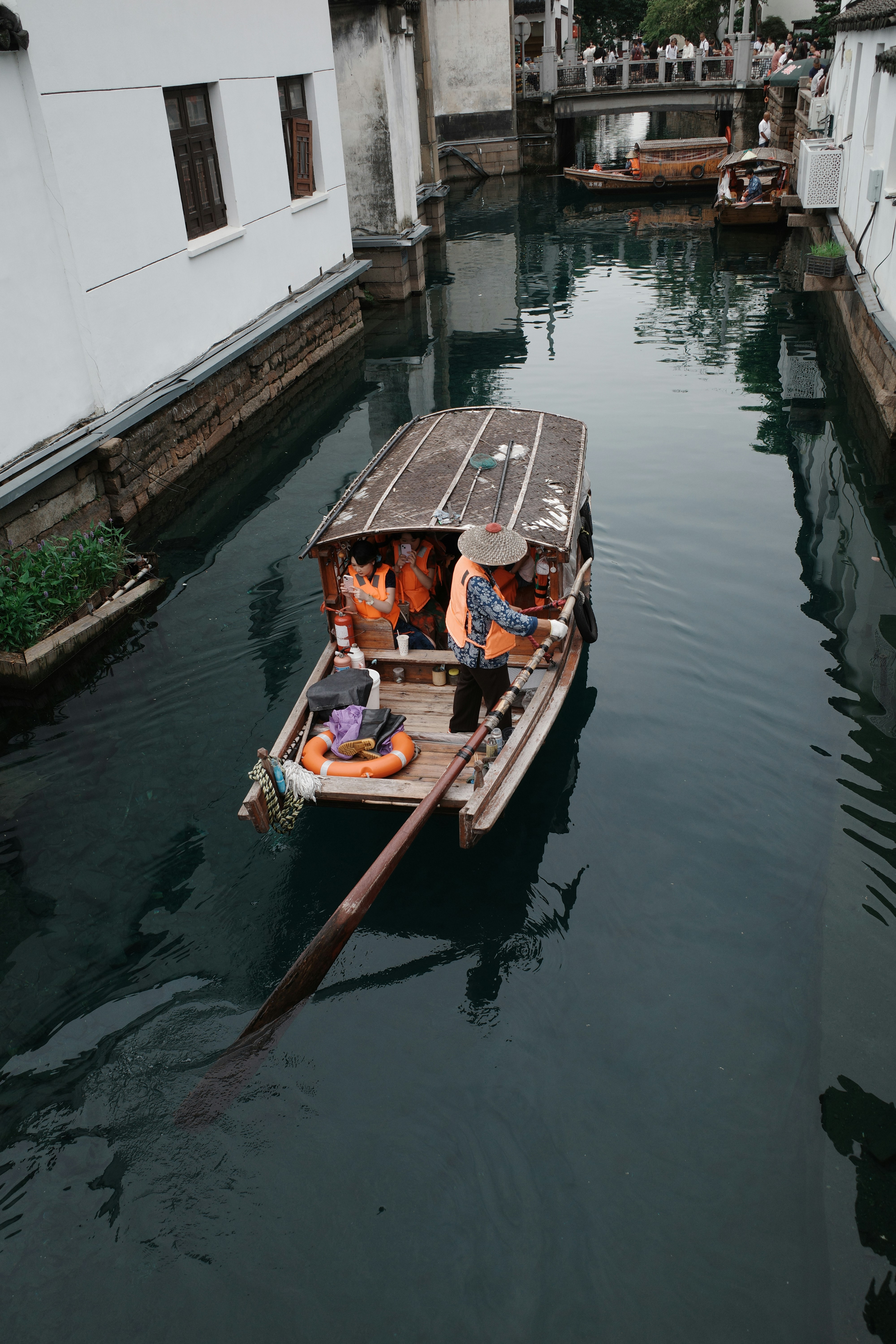A boat glides through a canal in china.