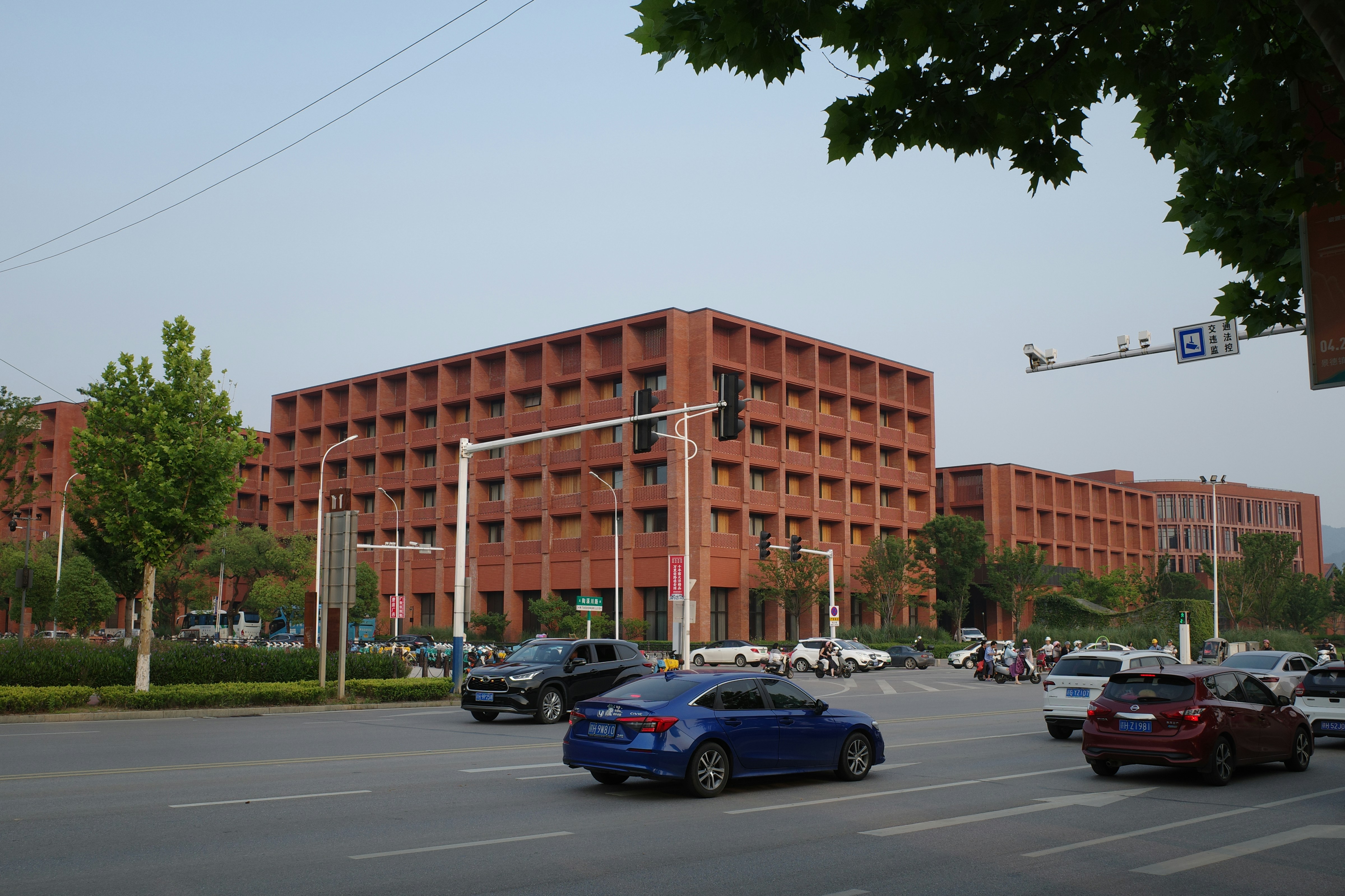 Modern buildings stand along a road.