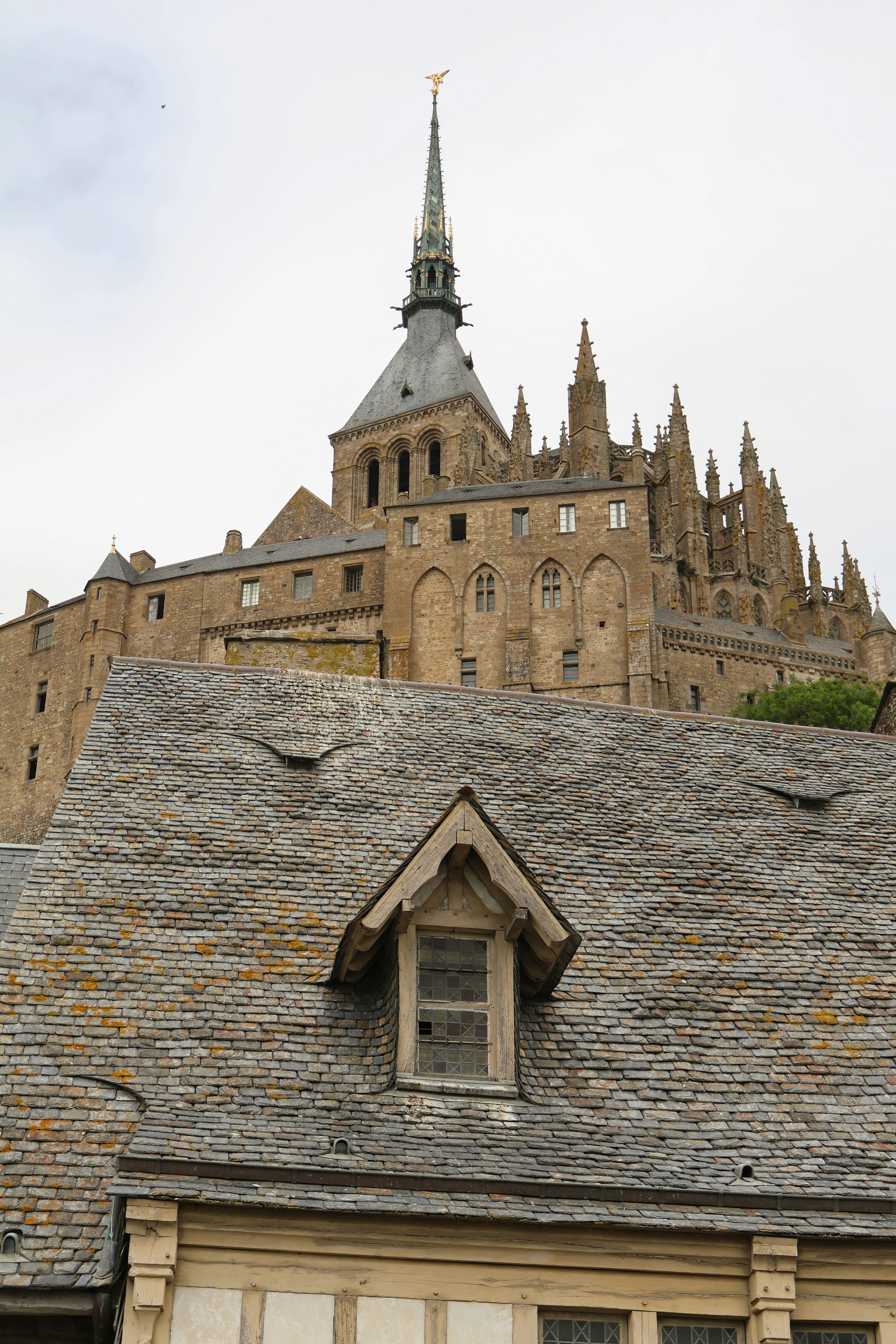 Mont Saint Michel church view from below in France | The historic mont saint-michel monastery sits on top.