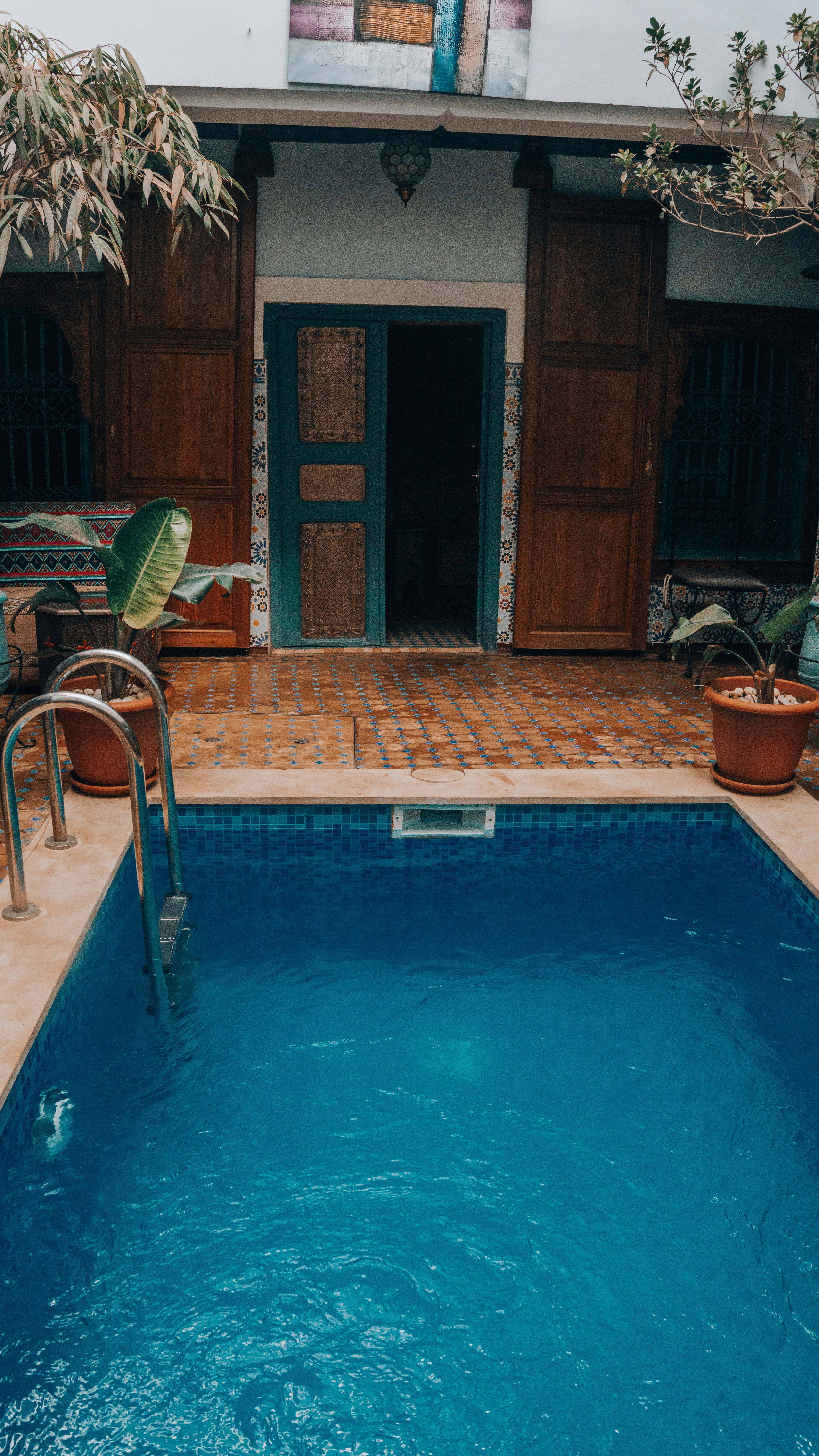 A pool and traditional architecture are shown.