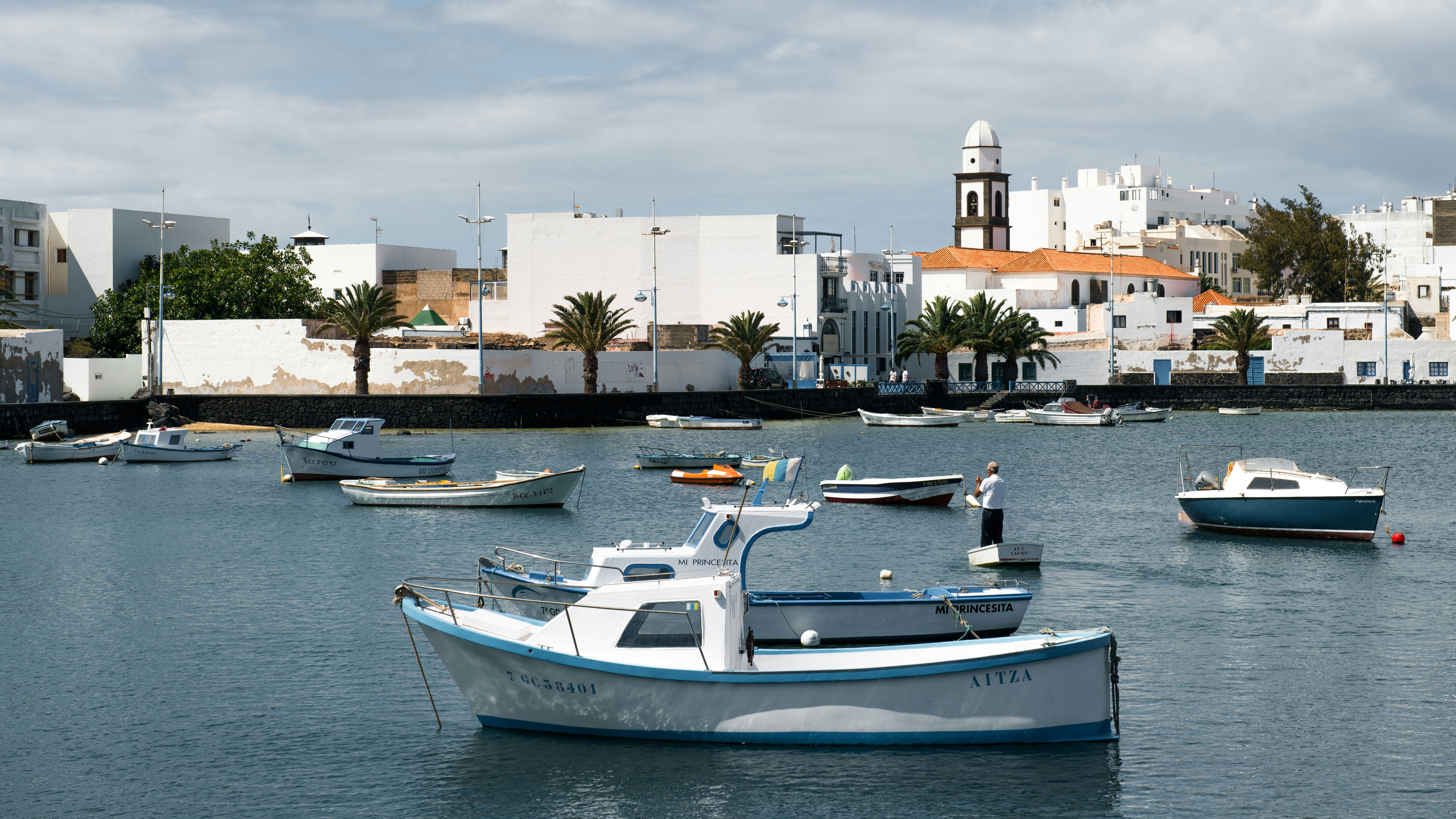 Boats float in a harbor near a town. photo – Free Lanzarote Image on ...
