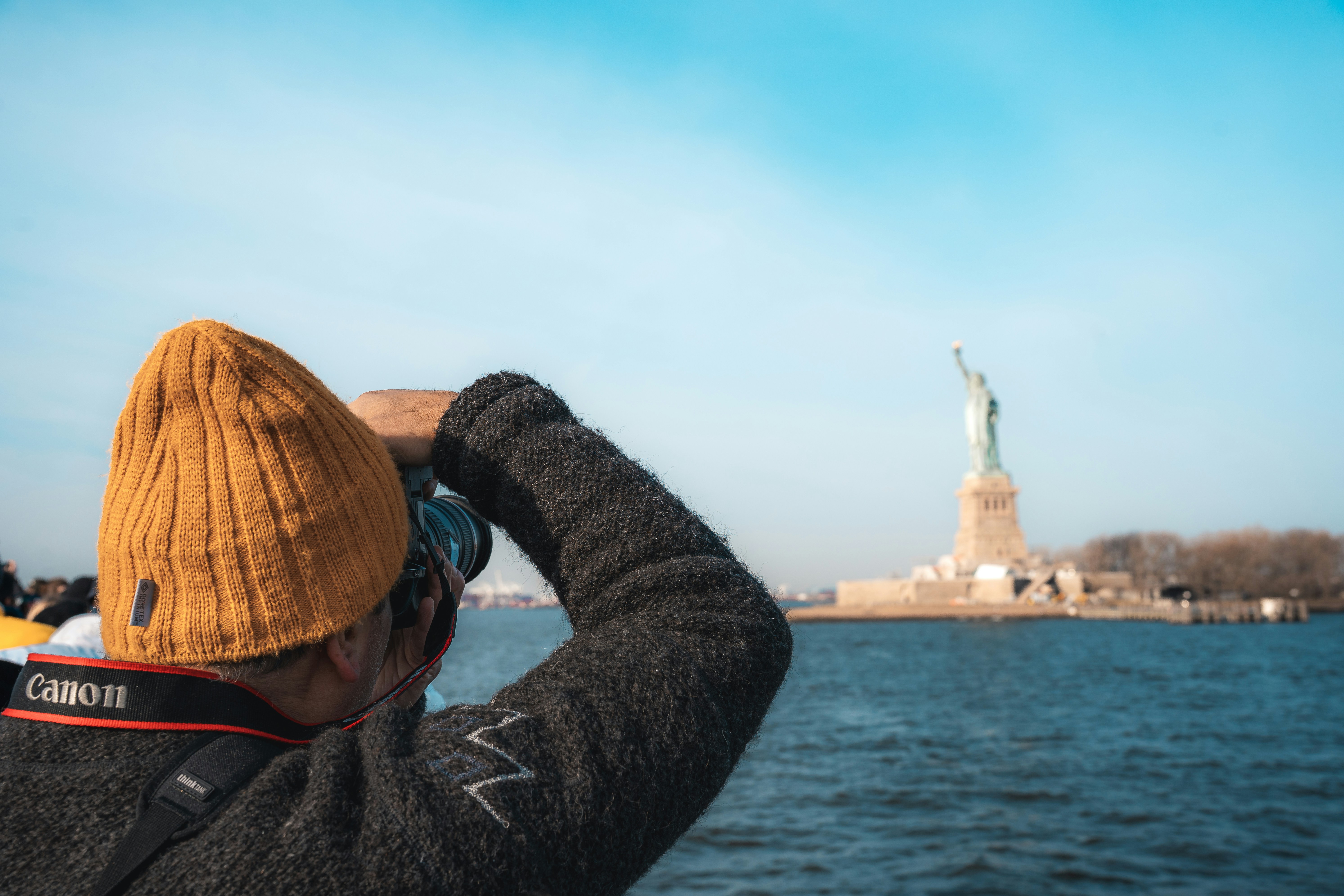 A person photographs the statue of liberty. photo – Free Art Image on ...