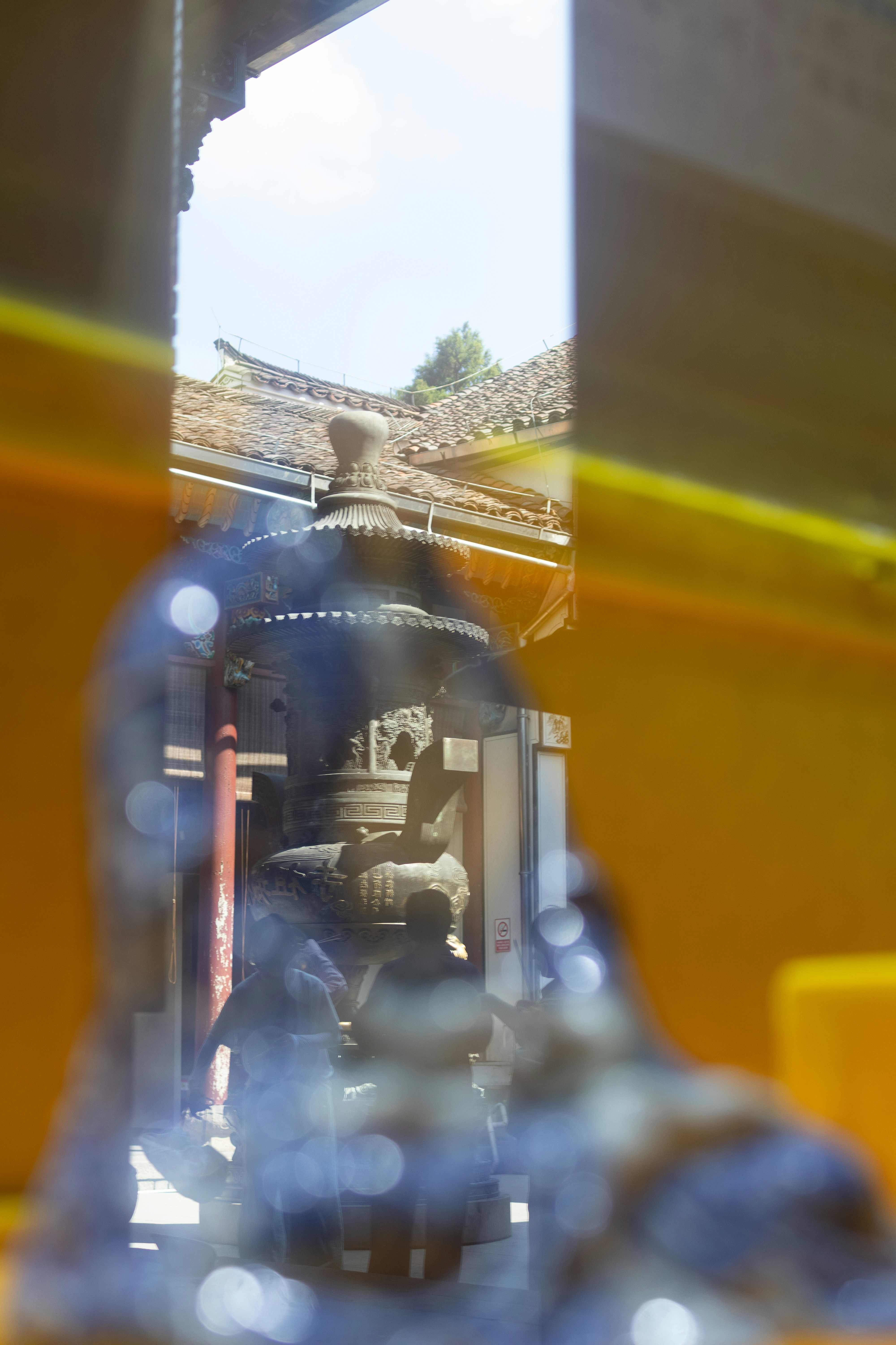 Amber Veil Over a Courtyard Fountain: A Stone centerpiece in muted light