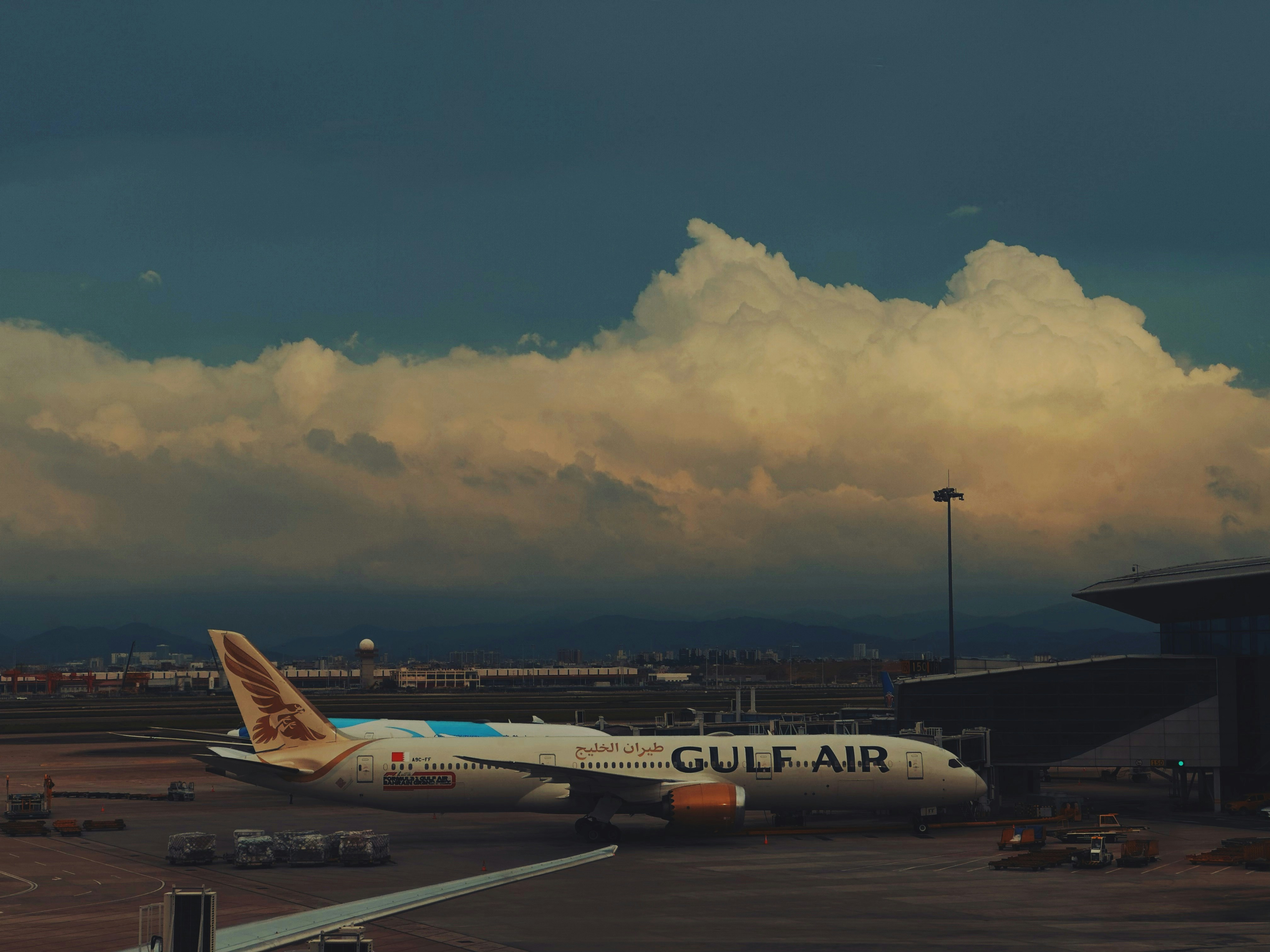 Gulf Air's Serene Departure Amidst Dramatic Skies