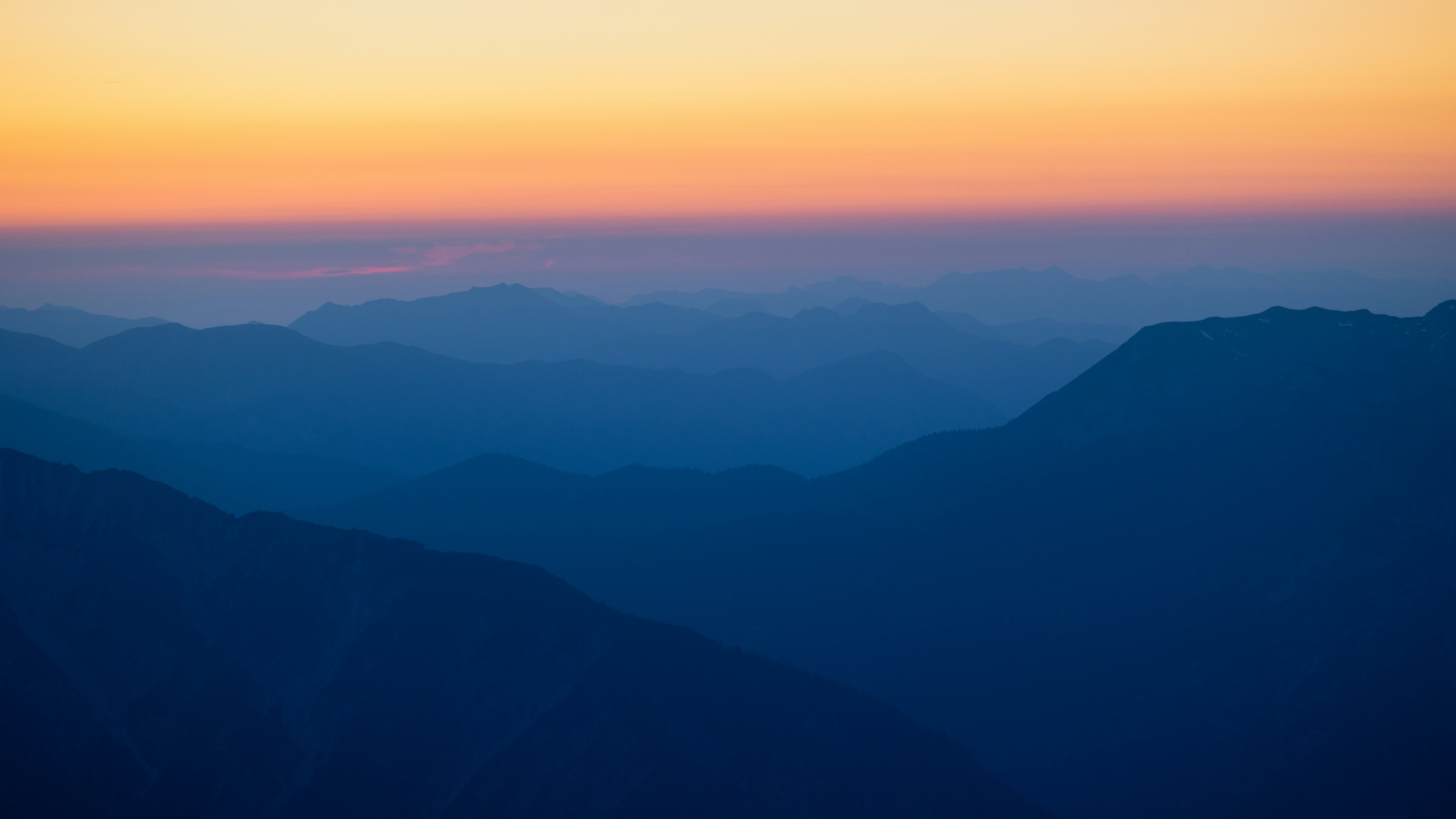 Mountains fade into the horizon during a sunset. photo – Free Horizon ...