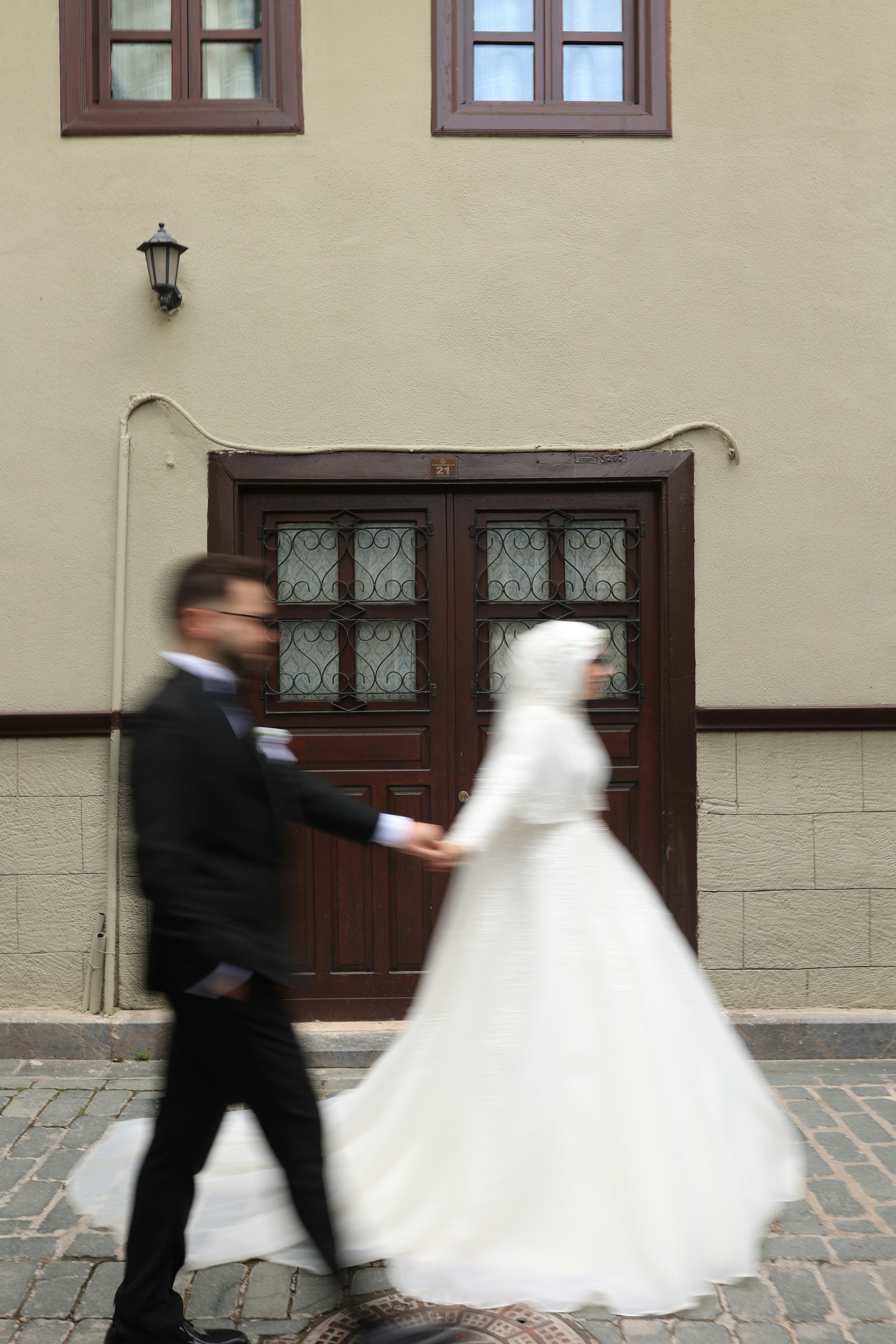 A newlywed couple is running away.