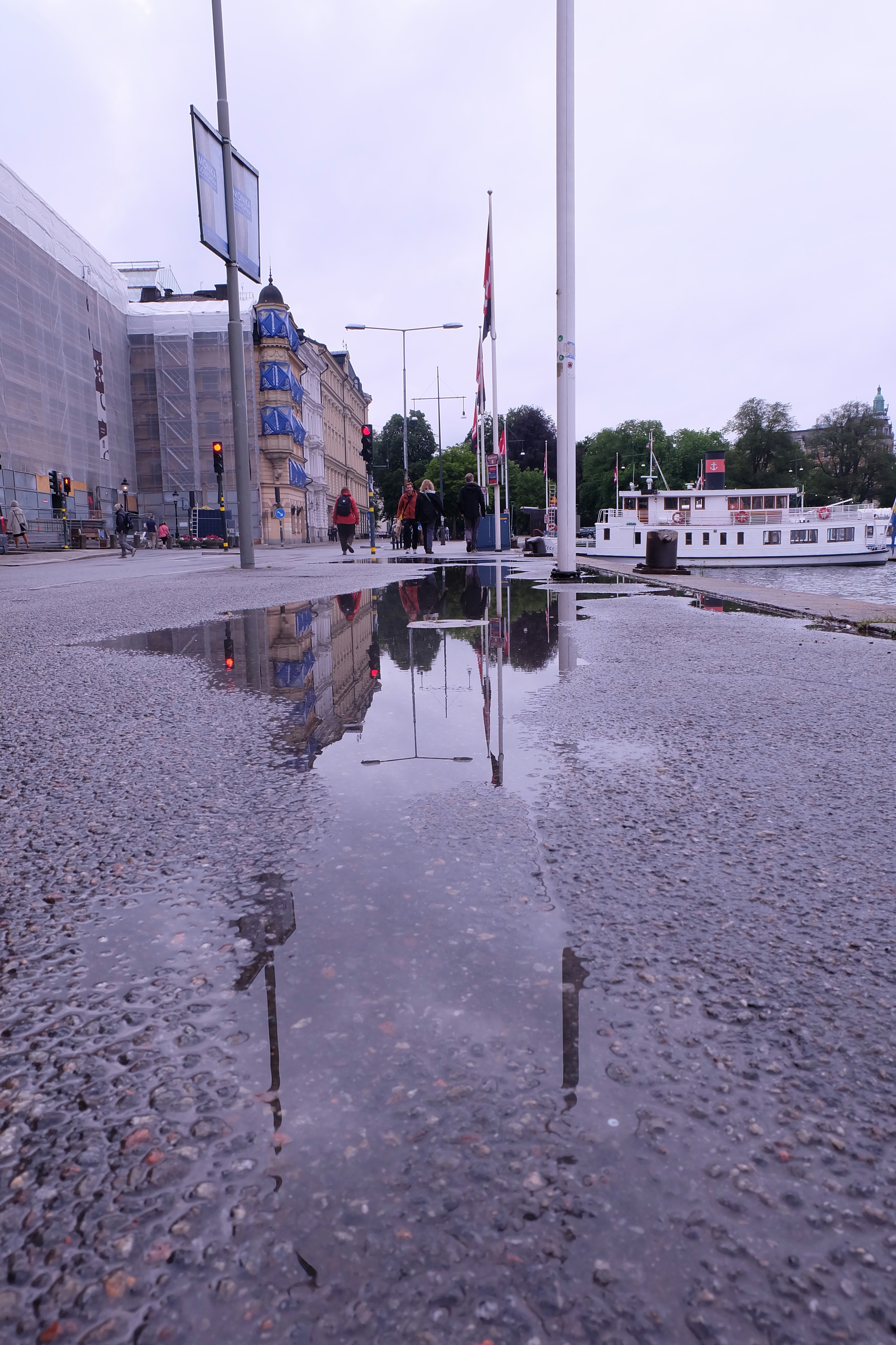 Reflections of Urban Life: A Rainy Day Perspective