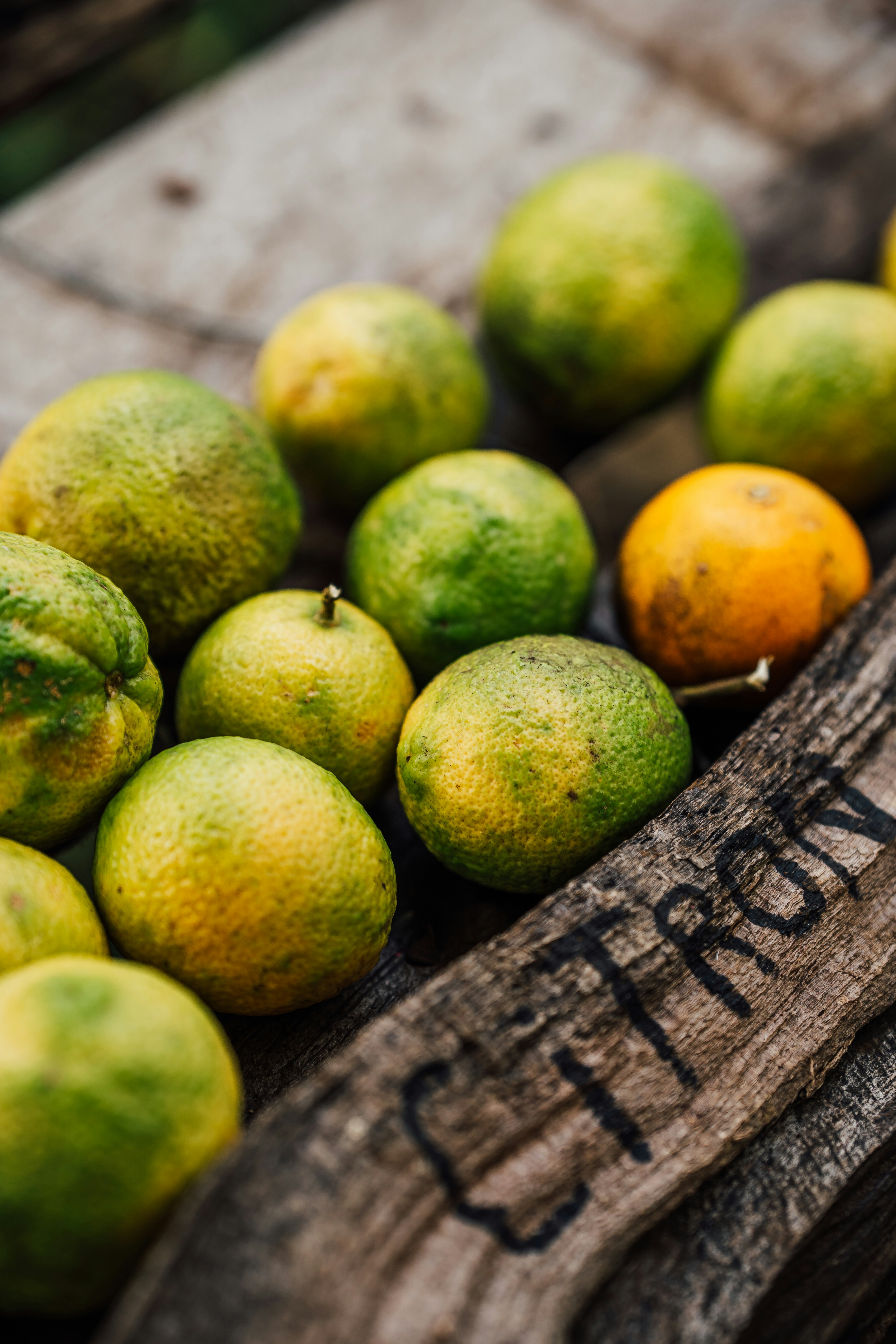 Crated Citrus: Sun-Warmed Limes on Weathered Wood