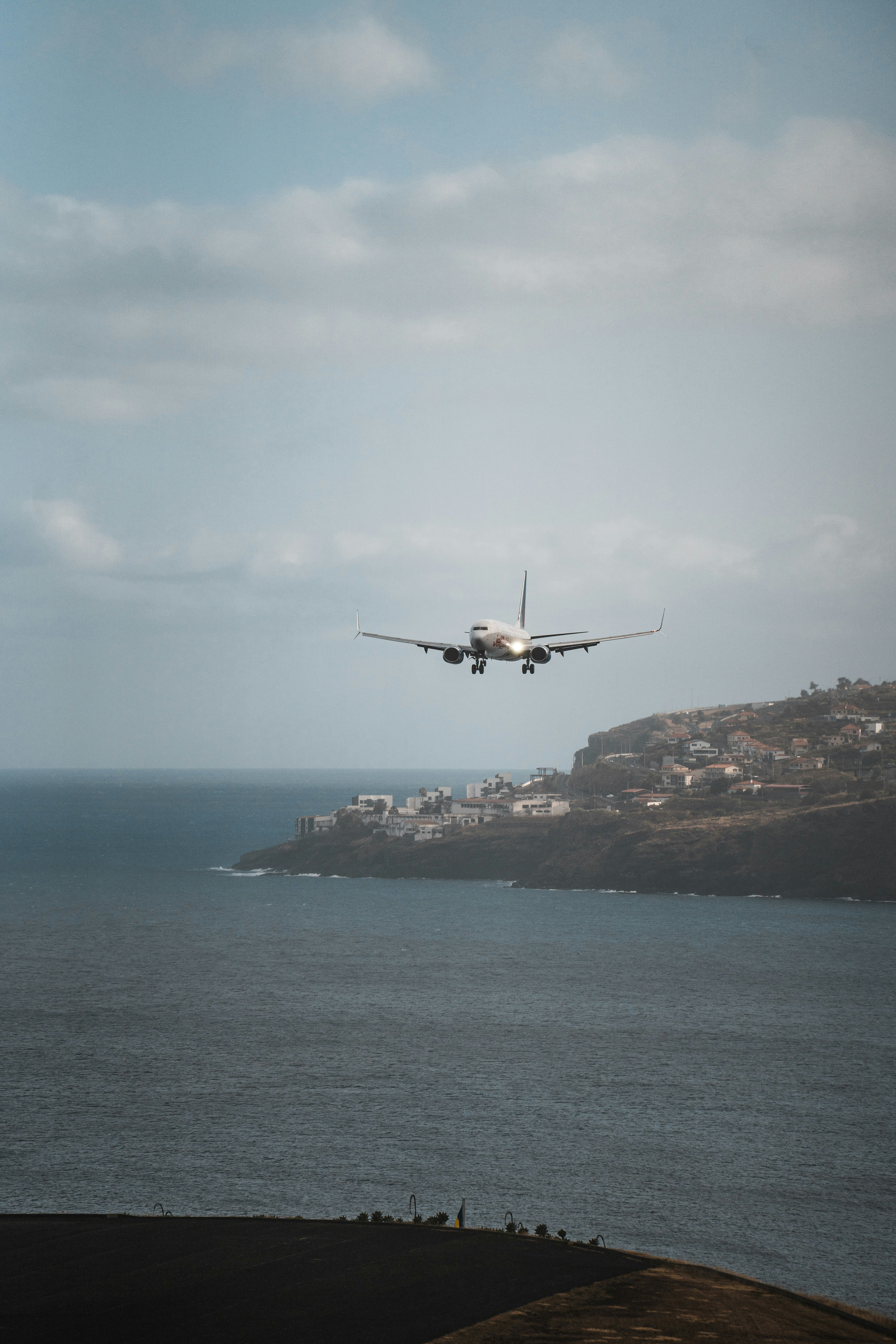 Approaching Horizon: Aerial Journey Over Coastal Serenity
