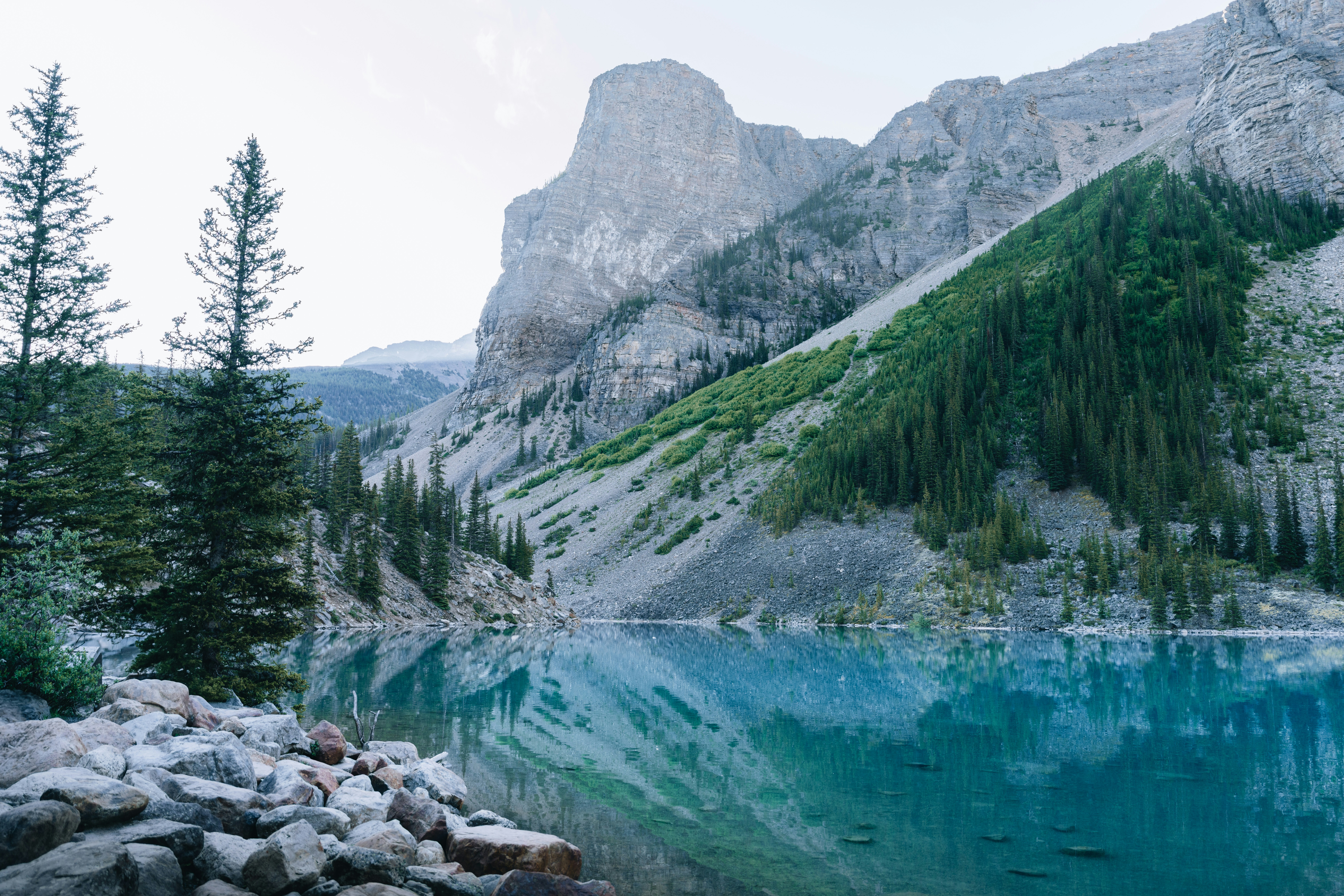 Mountains reflect in the beautiful turquoise lake.