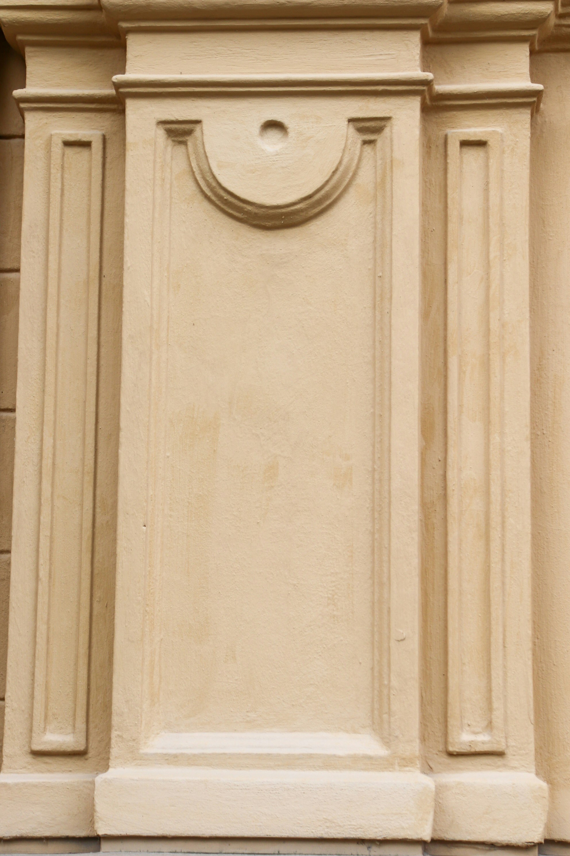 Textured wall panel featuring subtle curves and lines, highlighting architectural craftsmanship.