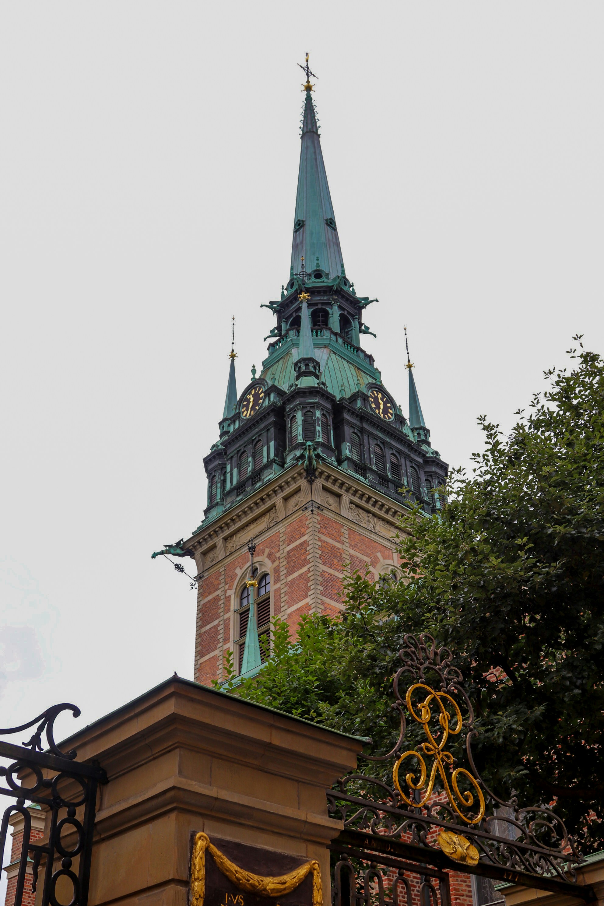 A tall church steeple soars upwards.