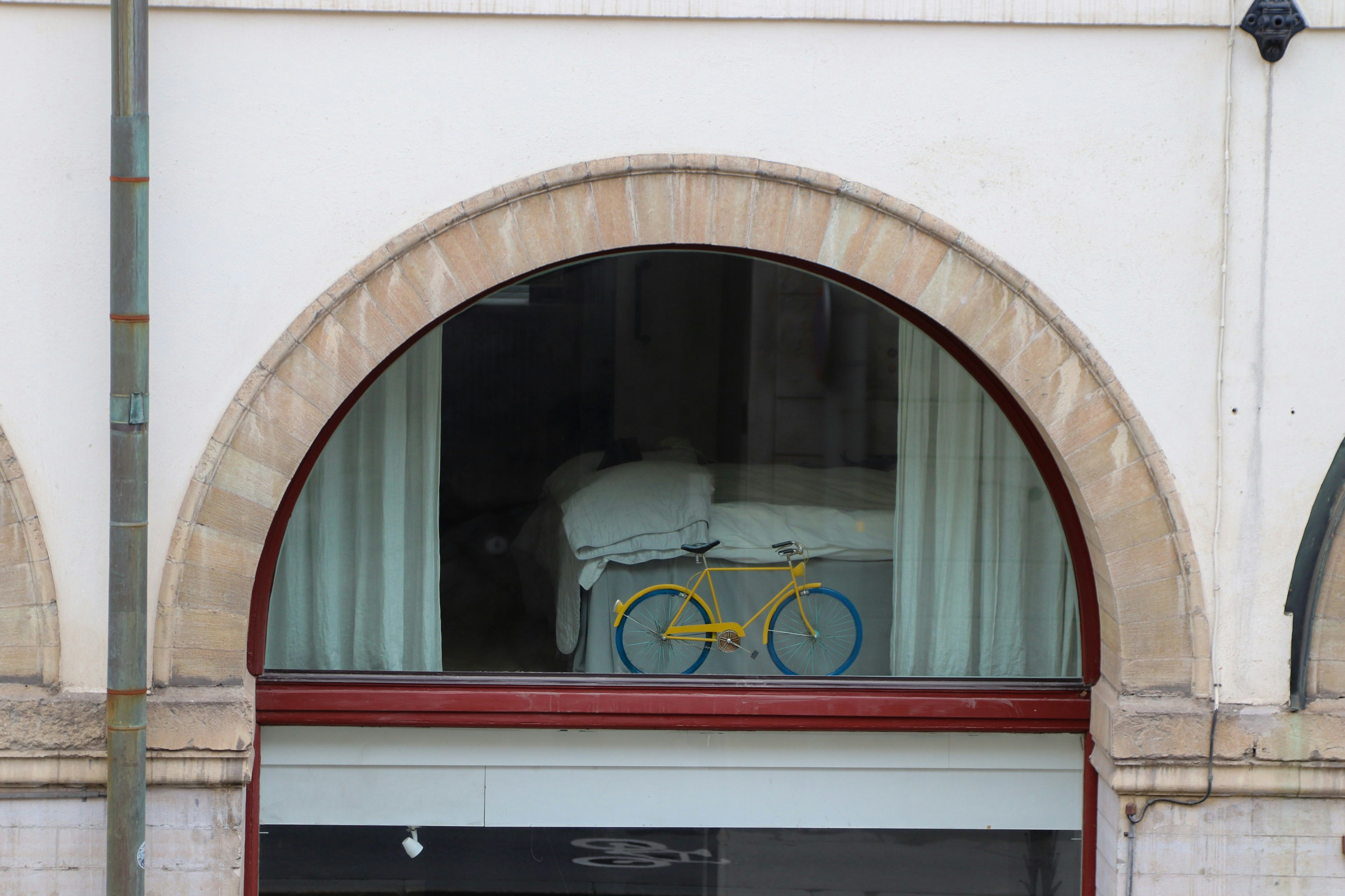 A Whimsical Touch: The Bicycle in the Window