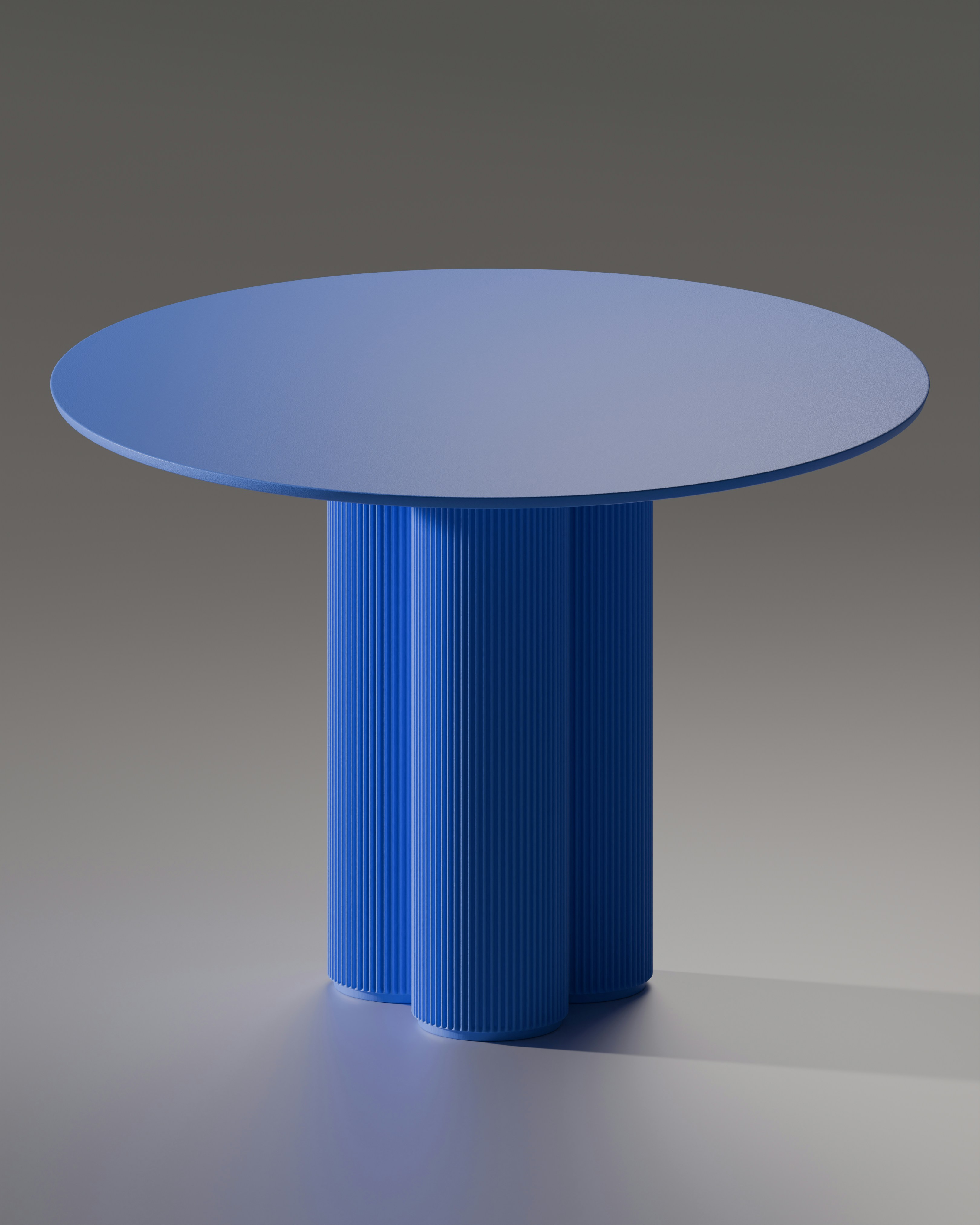 A modern blue table with a unique base. photo – Free Blue Image on Unsplash