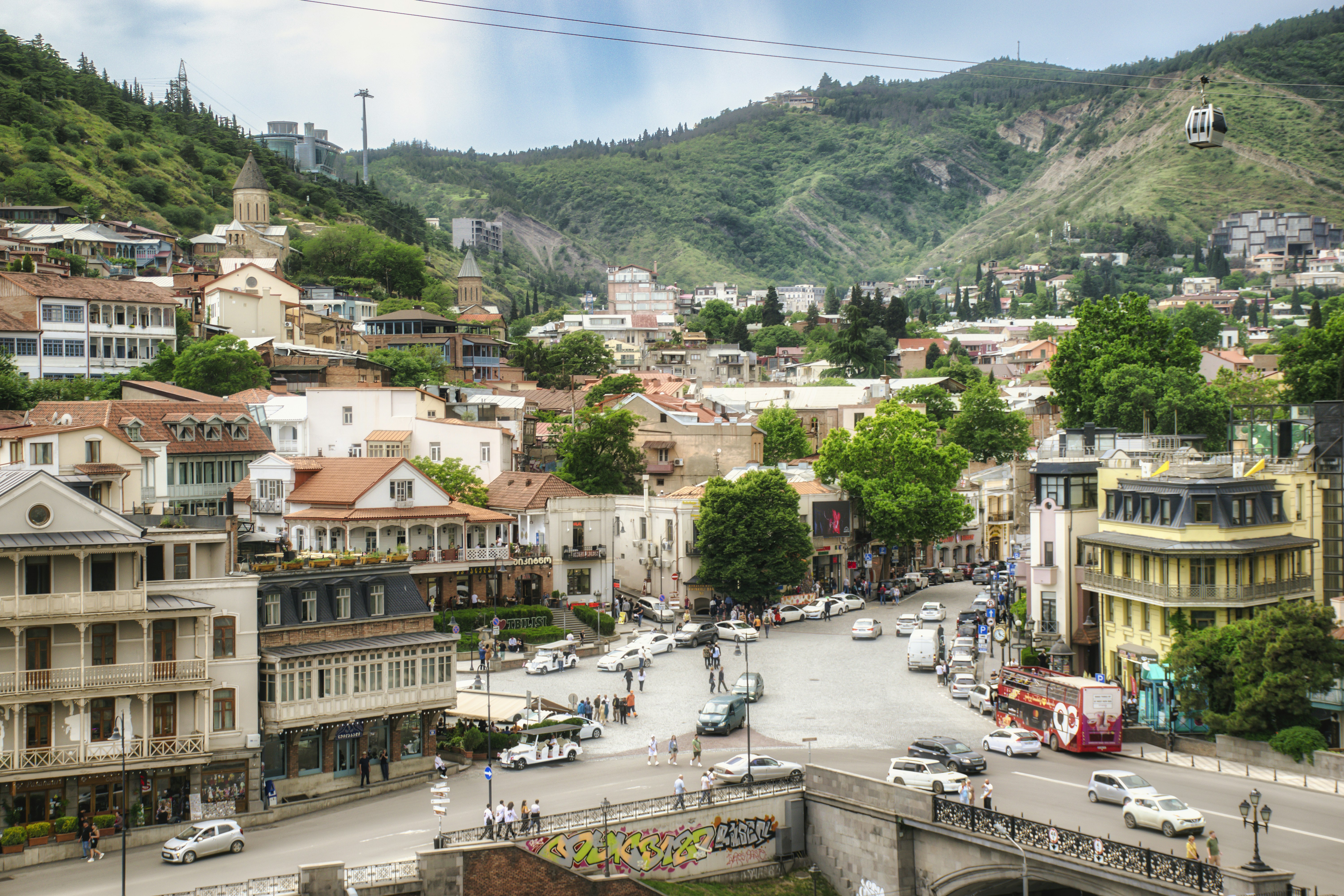A vibrant daytime scene from the heart of Tbilisi, Georgia. | Scenic view of a vibrant european city.