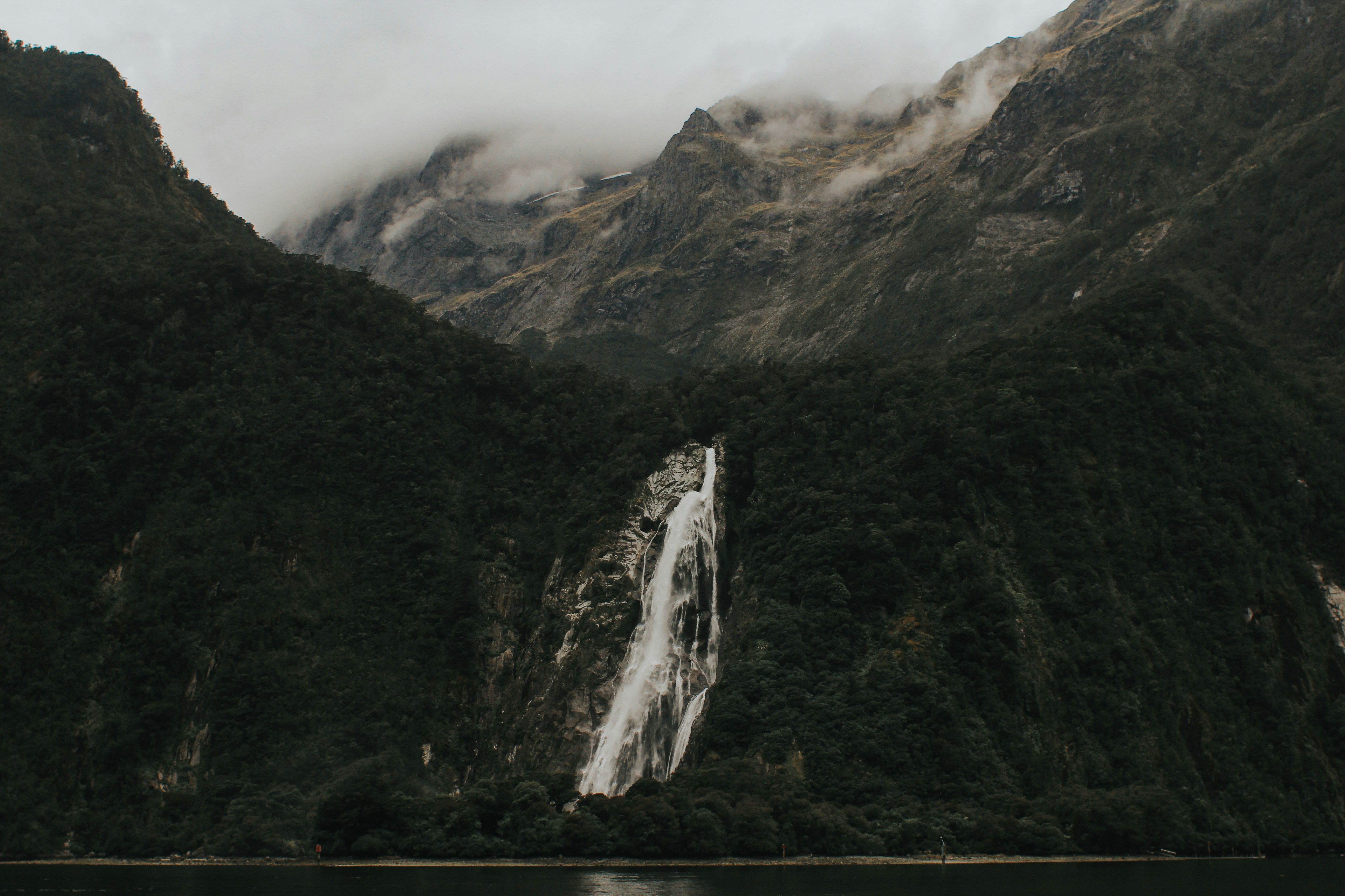 A waterfall cascades down a mountain.