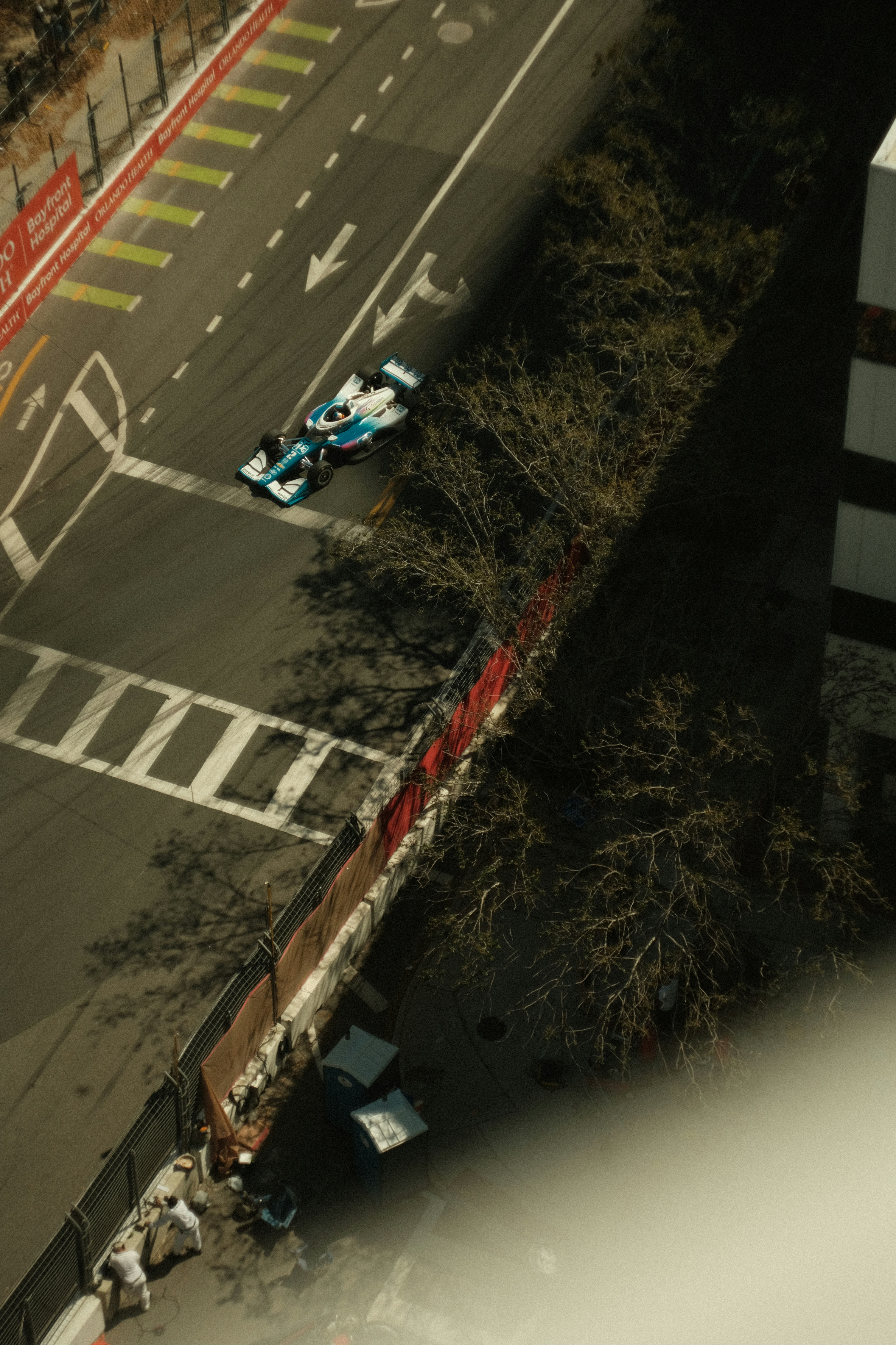 A race car drives around a closed course.