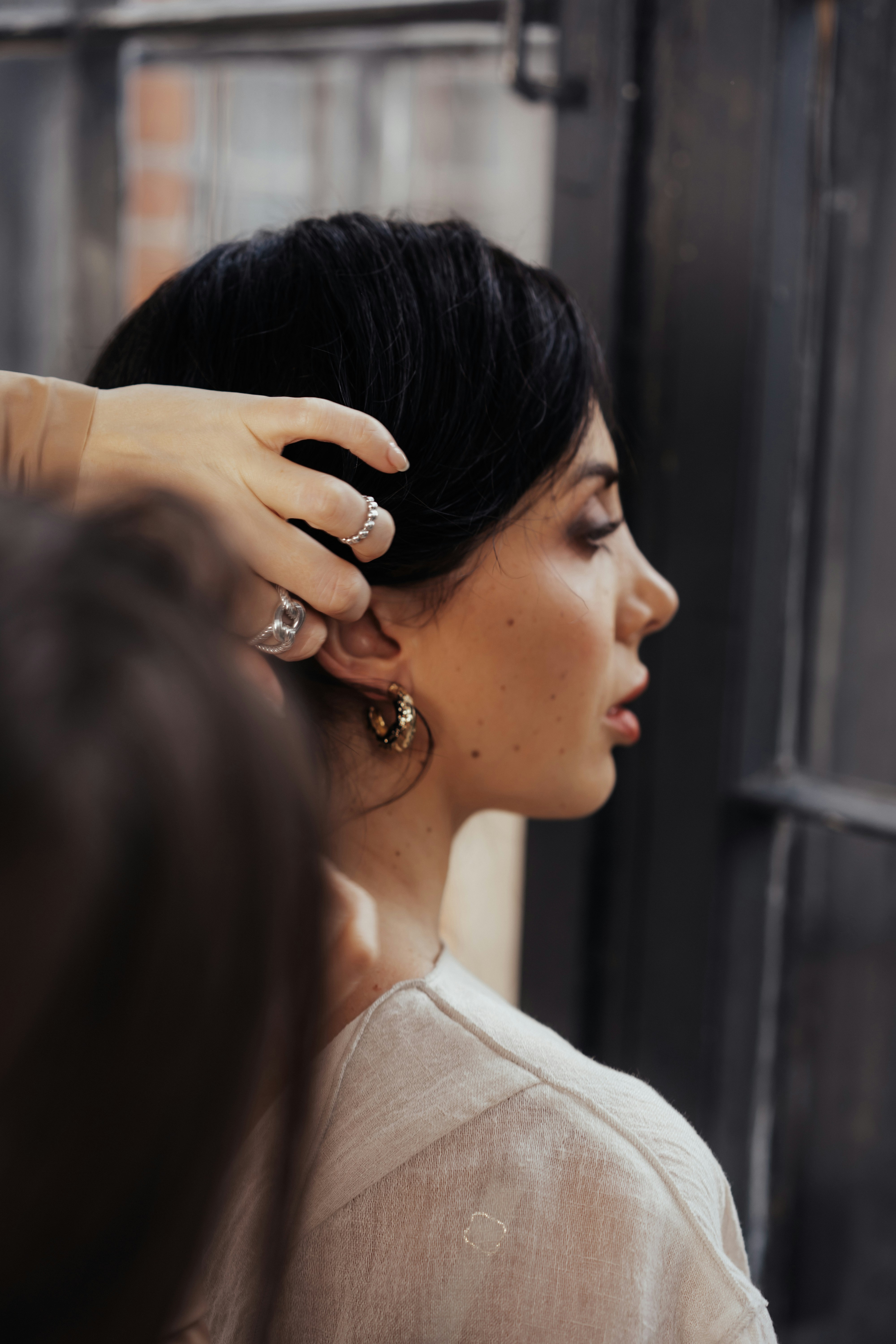 Elegance in Motion: A Hair Styling Moment