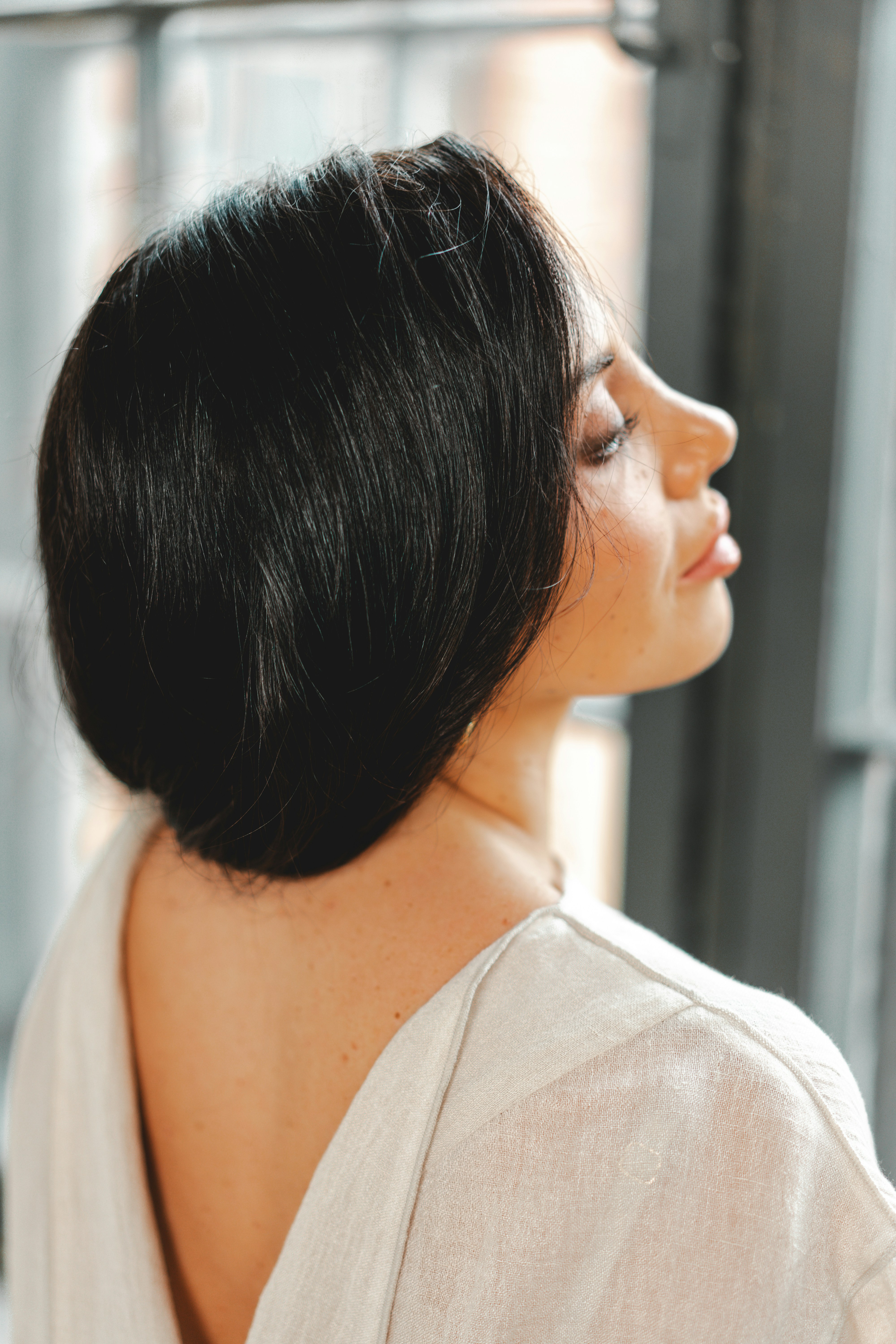 Model photoshoot | A woman poses gracefully with eyes closed.