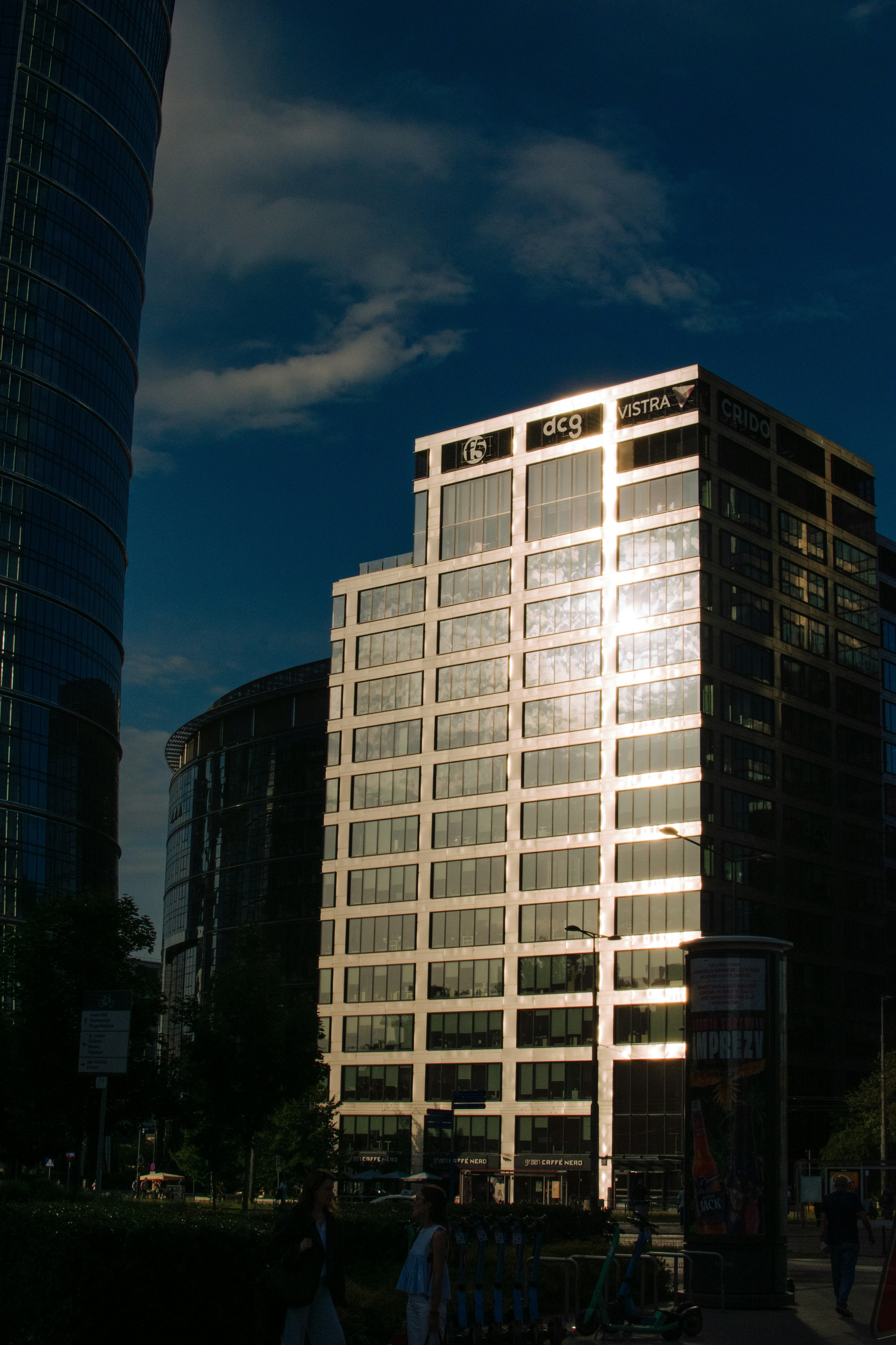 Skyscrapers bask in sunlight on a clear day.