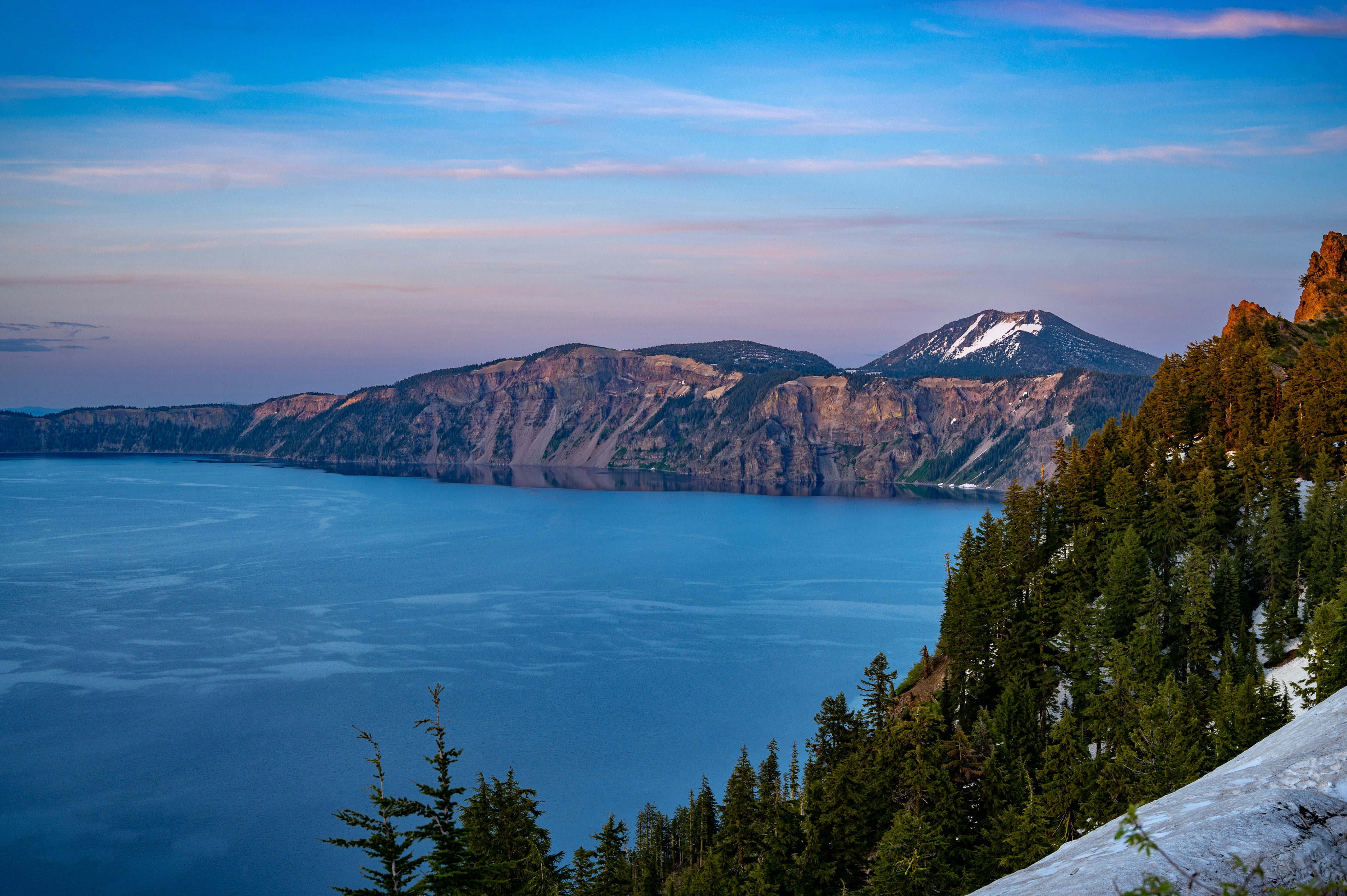 Snow-Capped Peak Over a Glassy Lake: Pine-Fringed Alpine Panorama