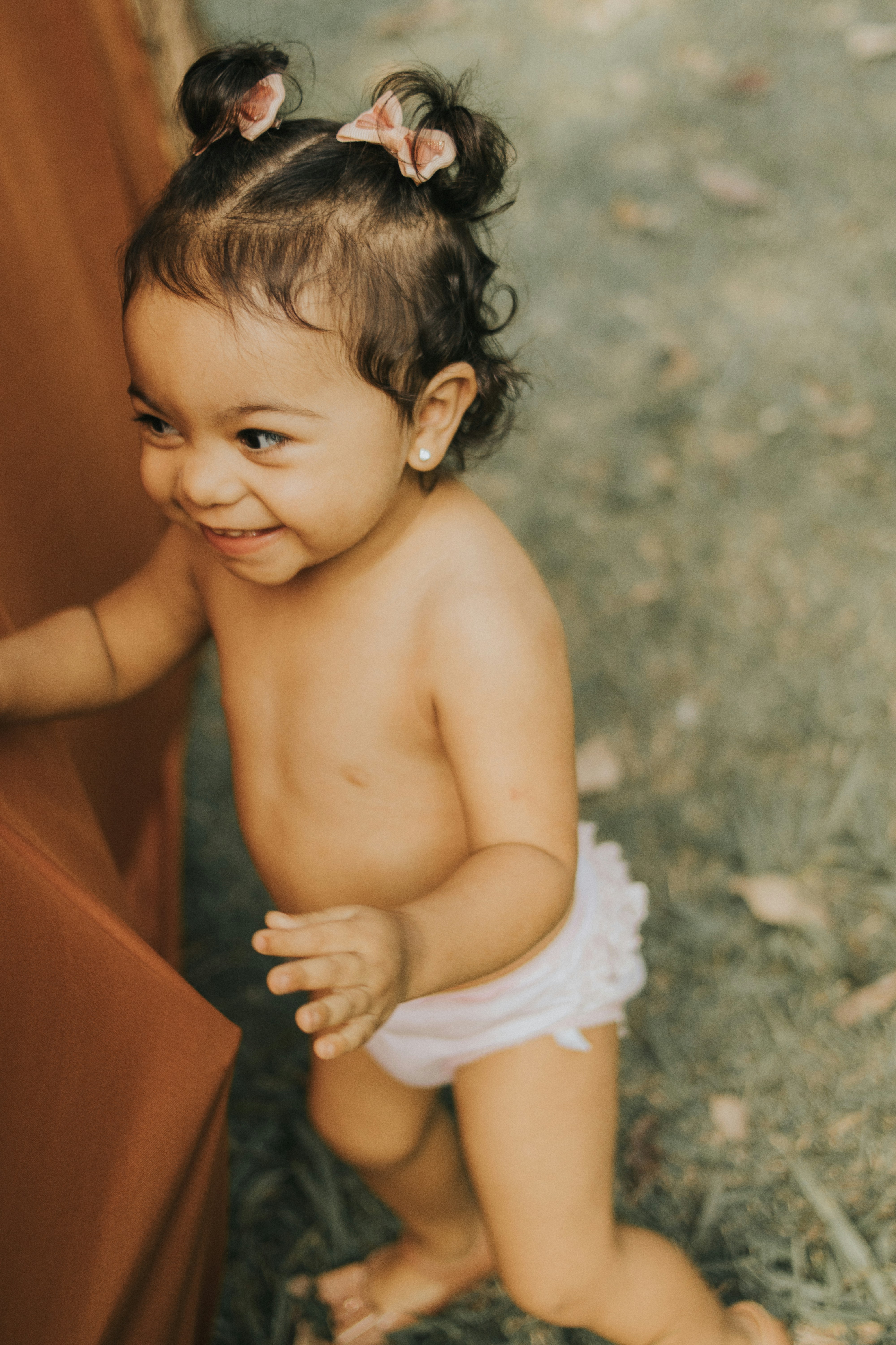 A happy baby girl smiles and plays outside. photo – Free Portrait Image ...