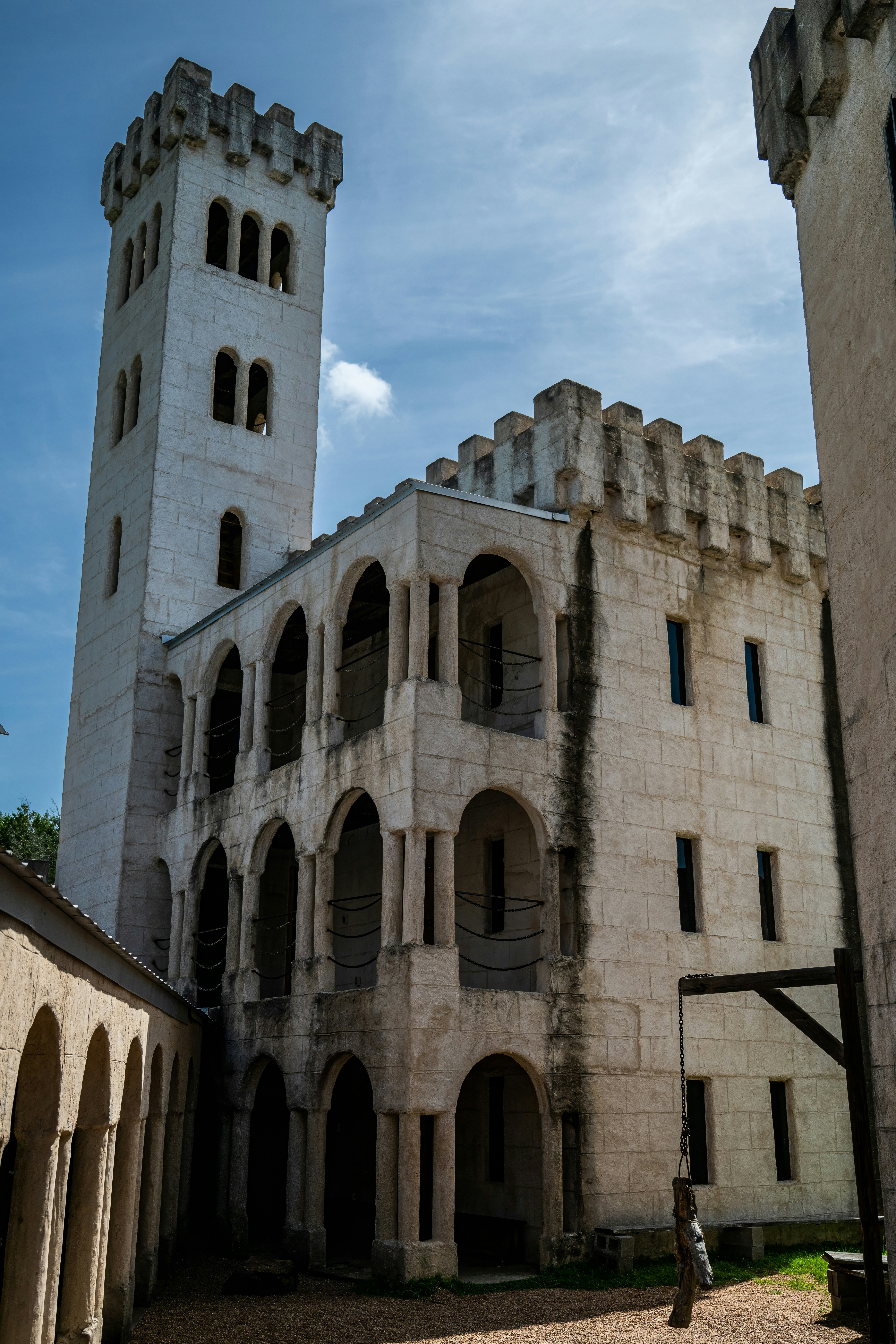 Medieval-style castle structure towers under the bright sky. photo ...