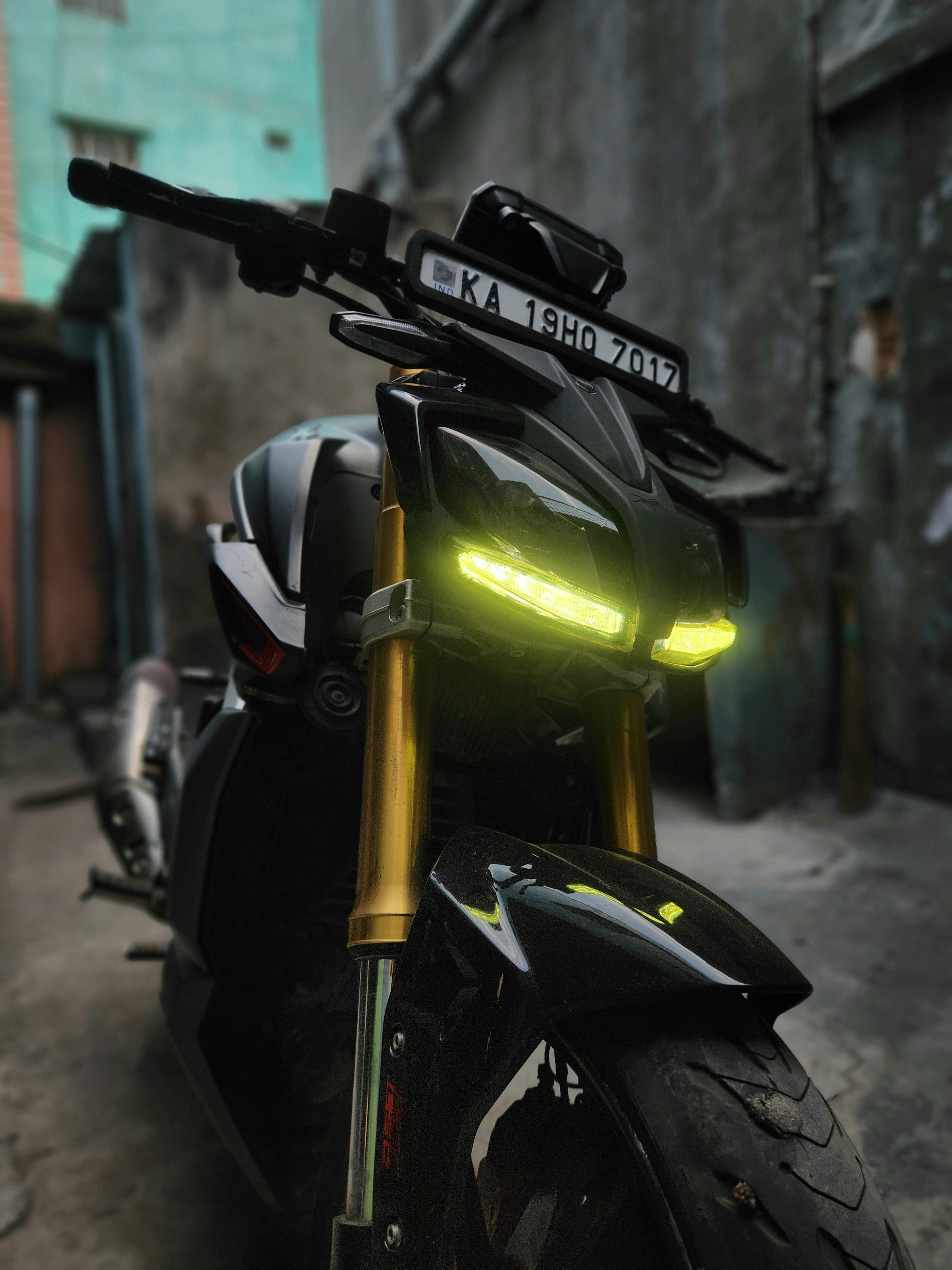 A sleek, black motorcycle with bright yellow lights. photo – Free ...