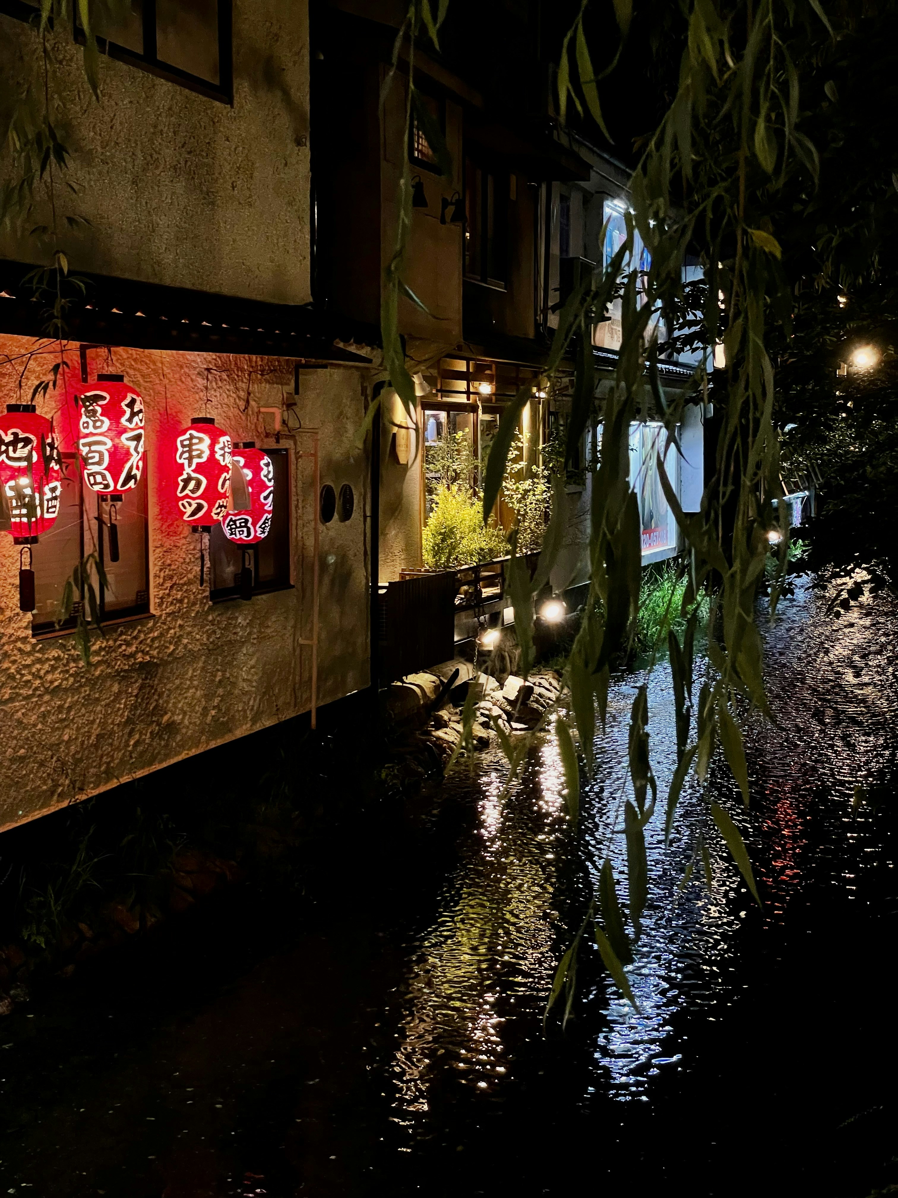 Lantern-Lit Canal: Riverside Night at a Cozy Eatery
