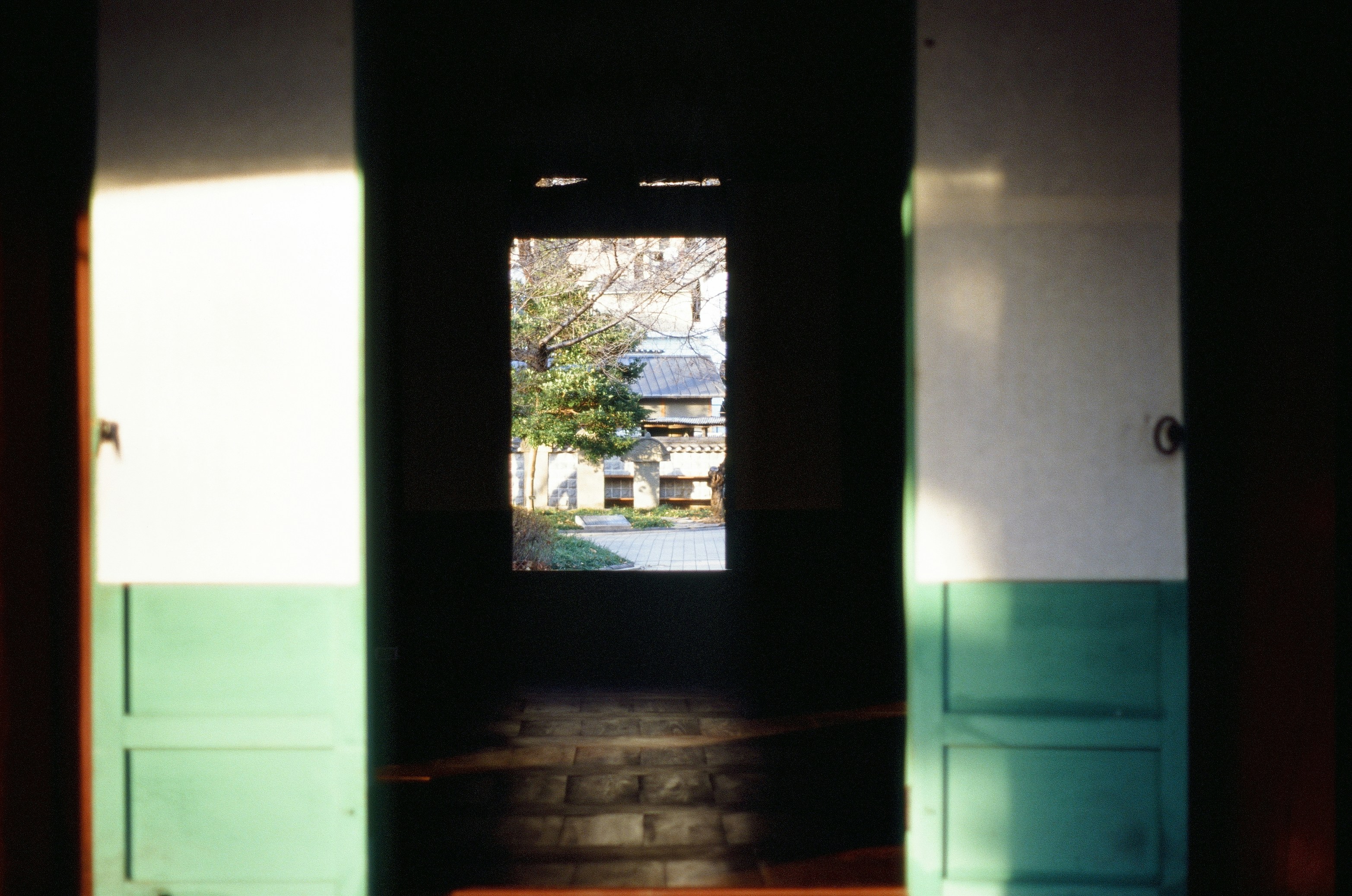 Open doors frame a view of a house. photo – Free Film photography Image ...