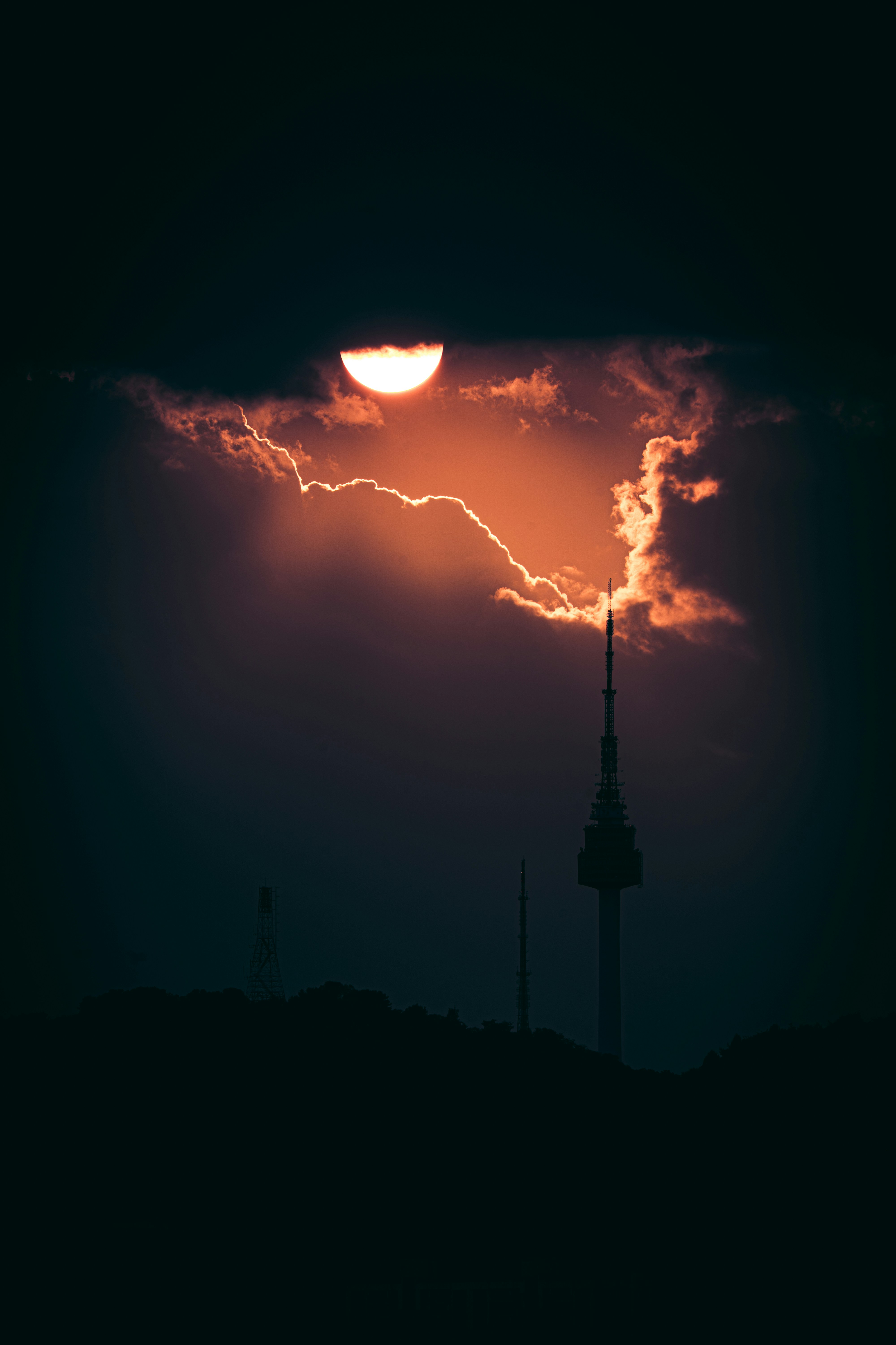 Silhouette of Innovation Against a Fiery Sky