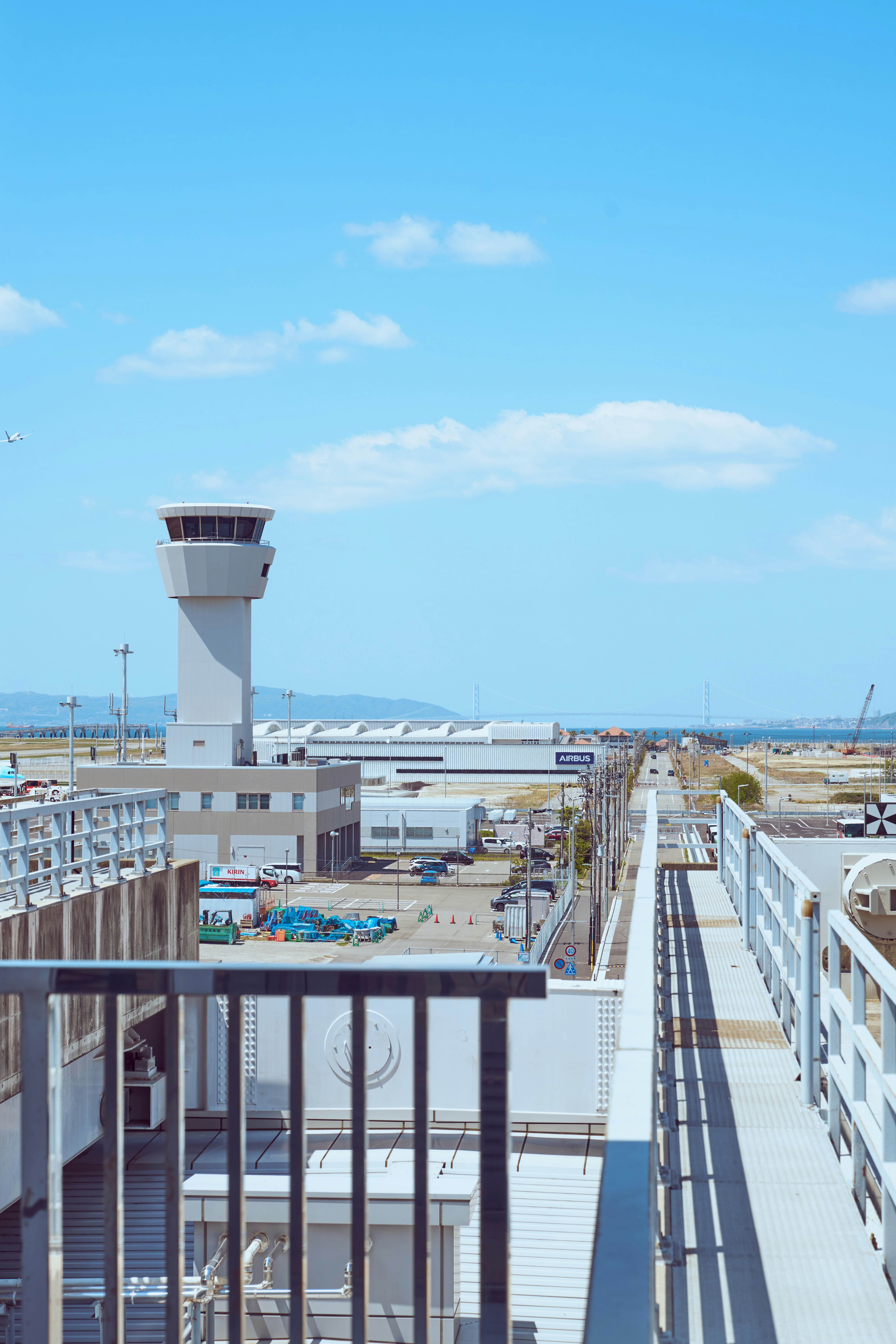 Kobe Airport, April 2025 | Airport scene with a control tower under a blue sky.