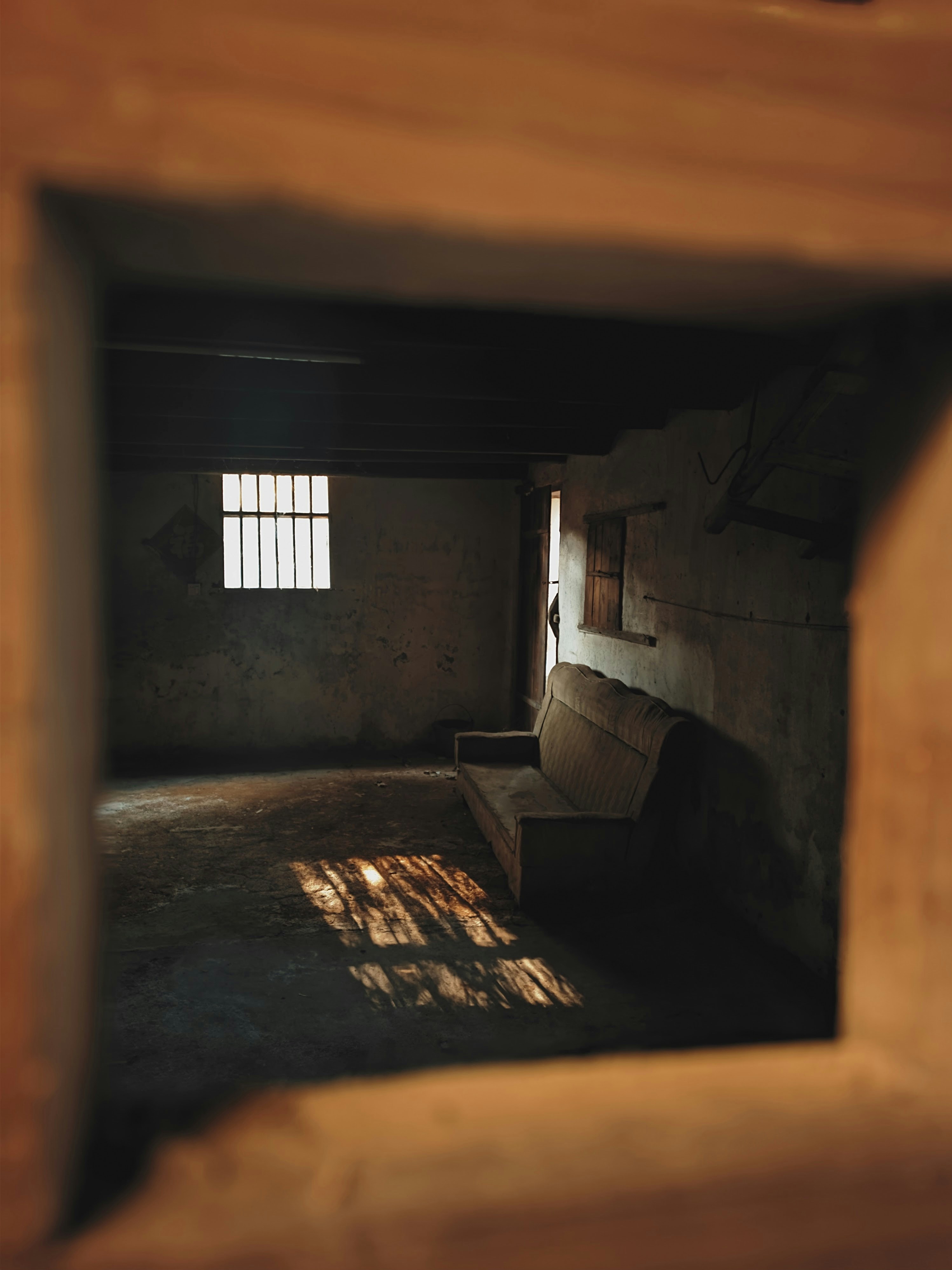 An abandoned room has sunlight shining in.