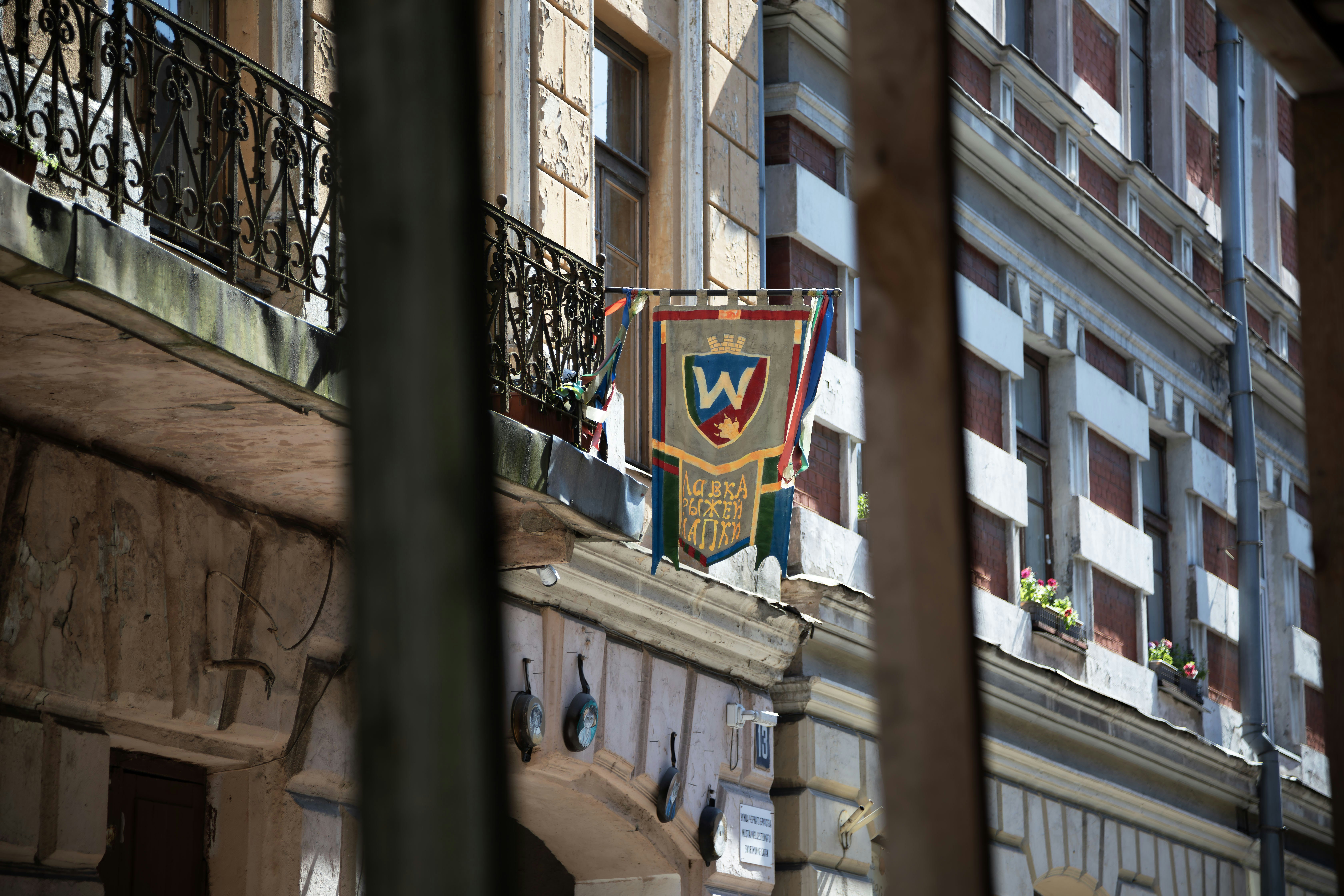 Crest Banner Adorns a Weathered European Facade
