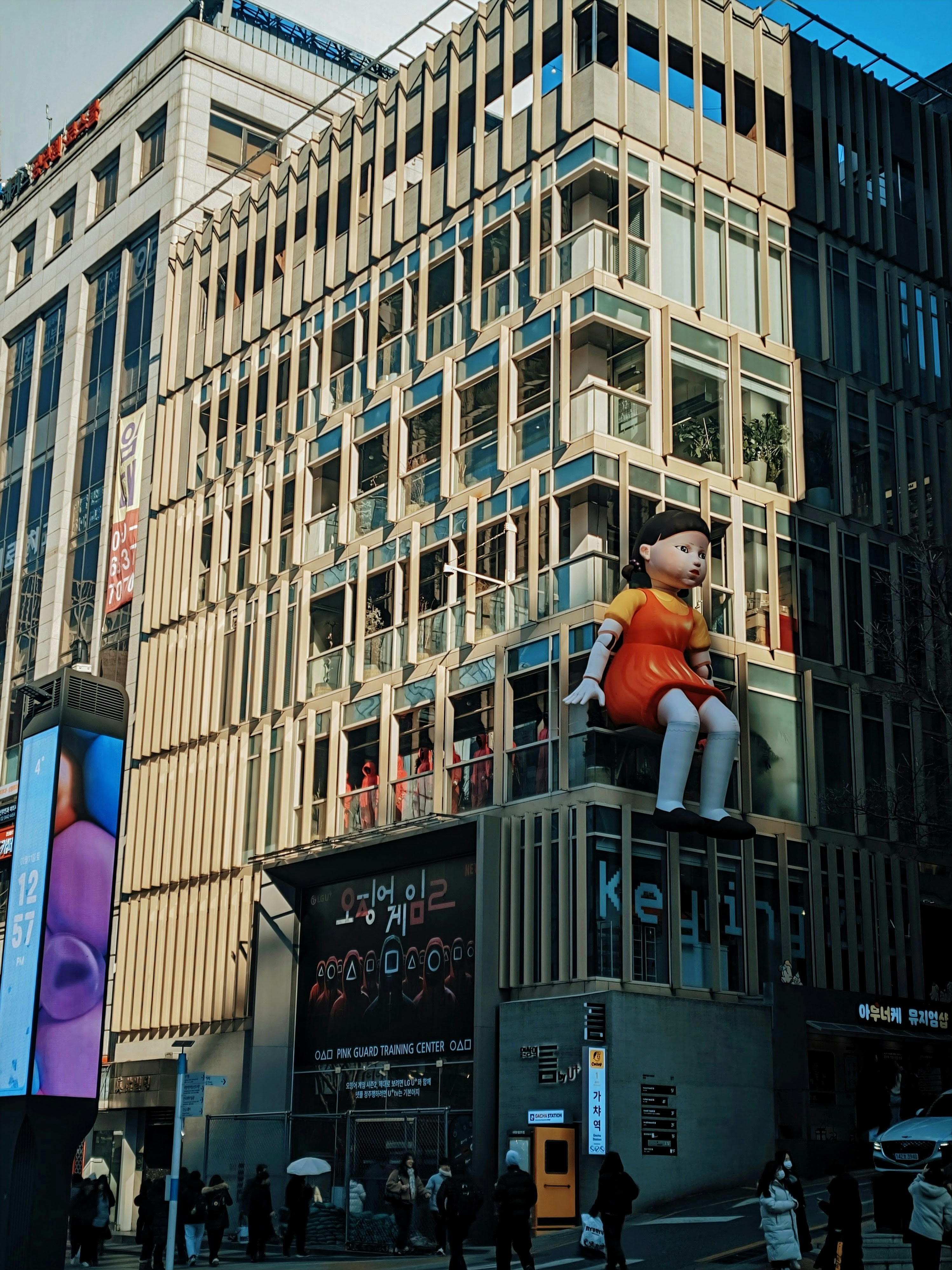 A giant doll decorates a building in seoul.