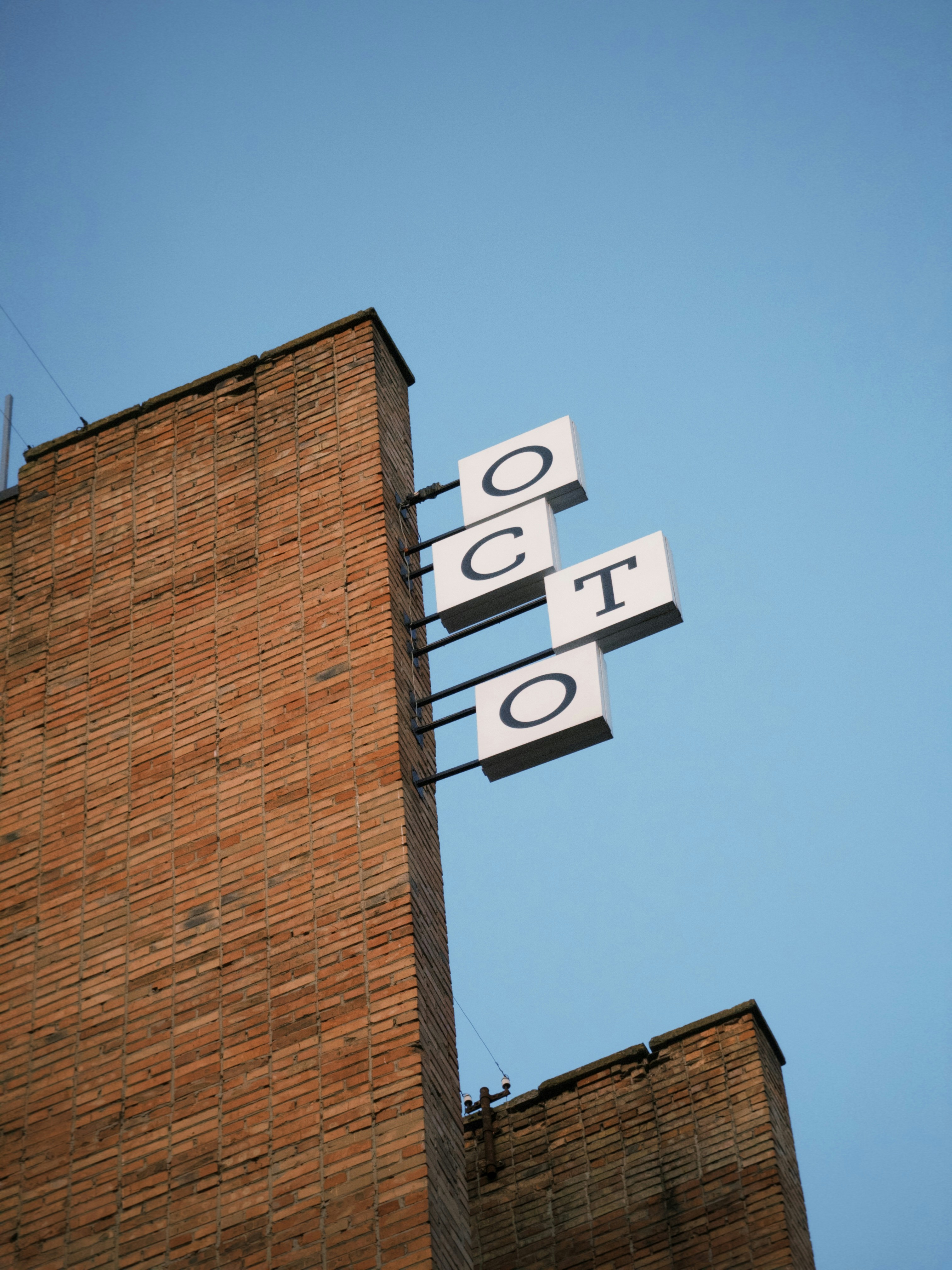 The brick building displays the word "octo." photo – Free City Image on ...
