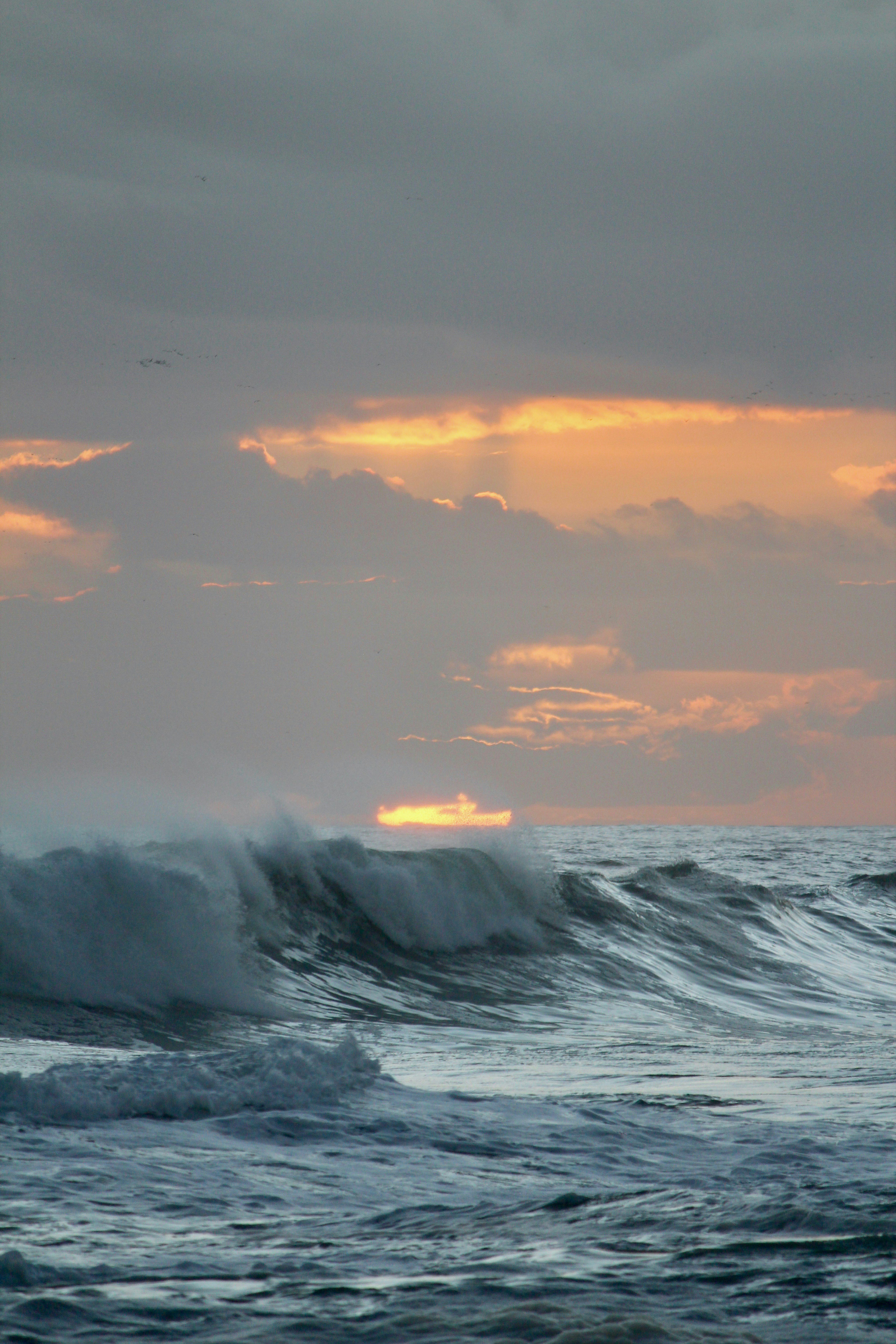 Be like a Golden Sunset Ship and sail off into yourself. | Waves crash as the sun sets over the ocean.