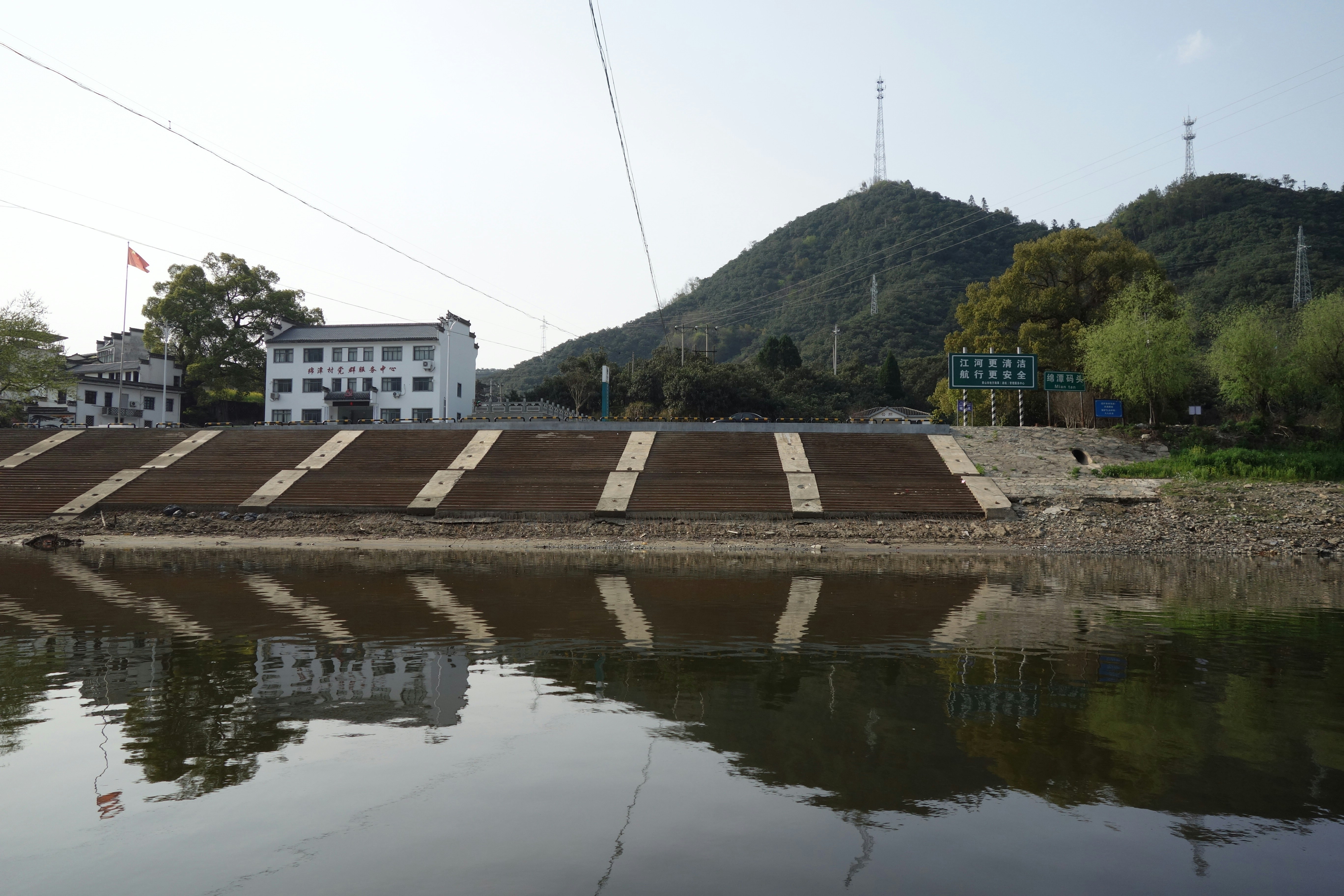 Reflections of Tranquility: A Riverbank Scene
