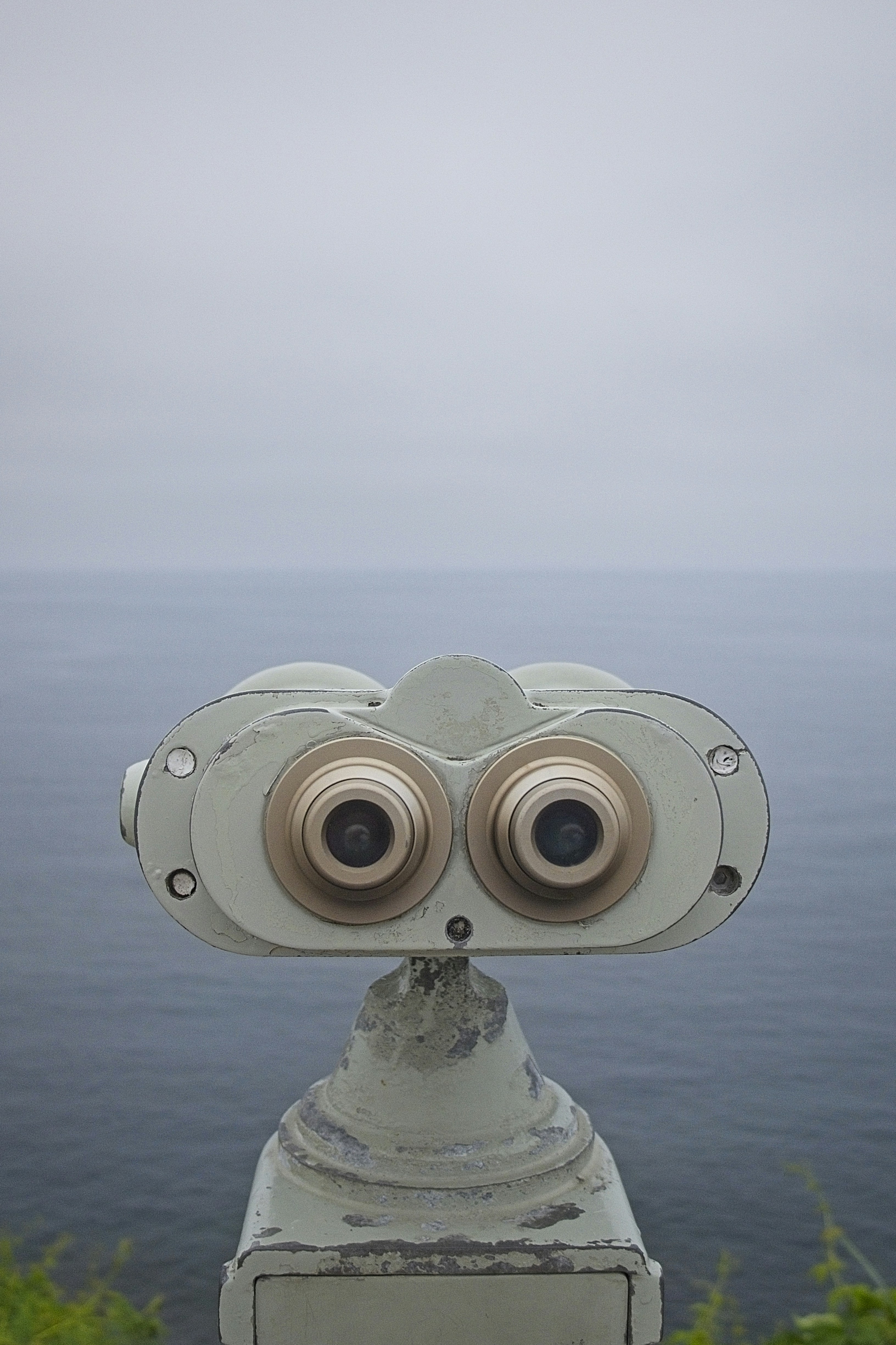 Binoculars stare out at the ocean.