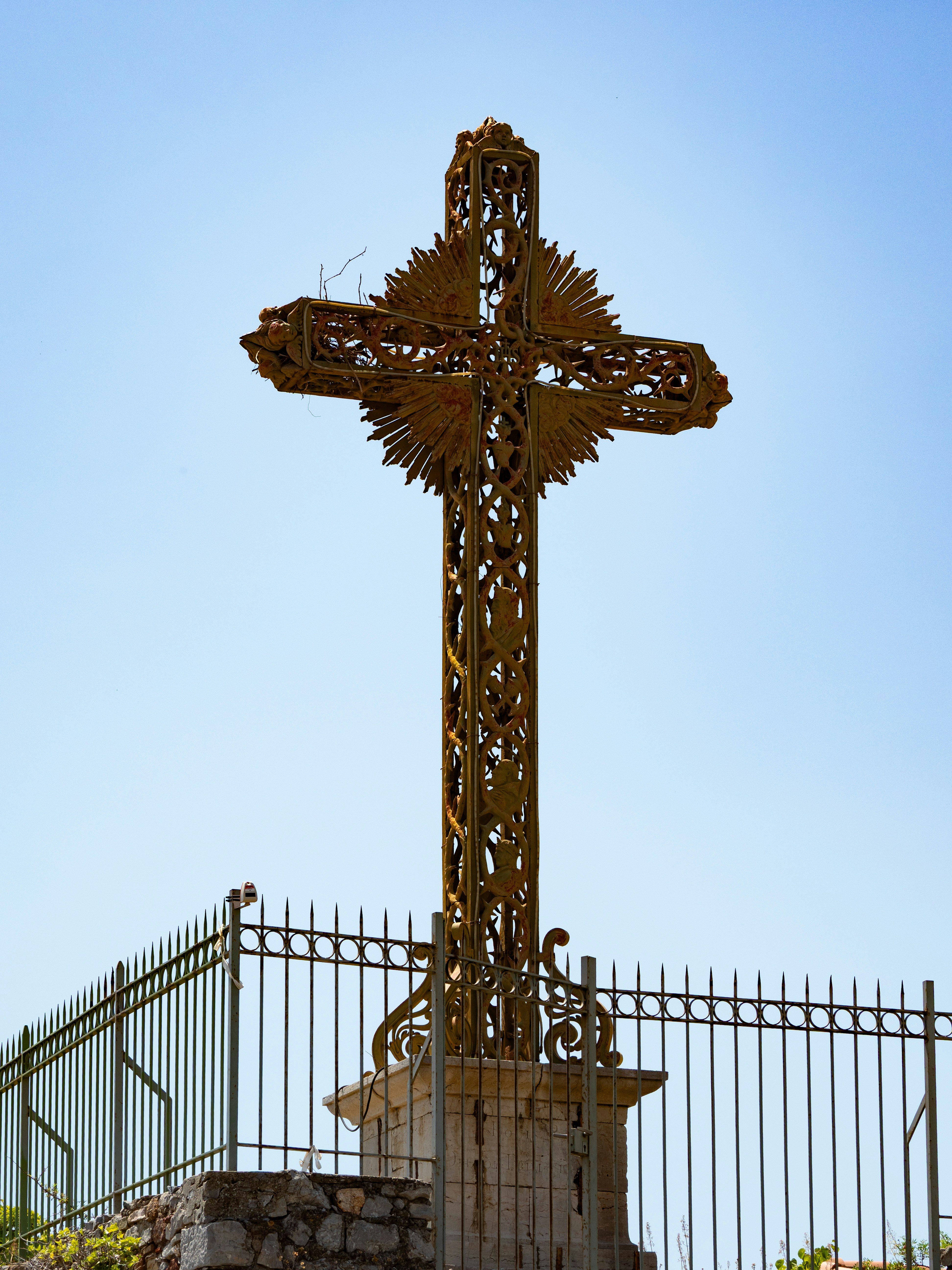 The Golden Sentinel: A Cross Against the Sky