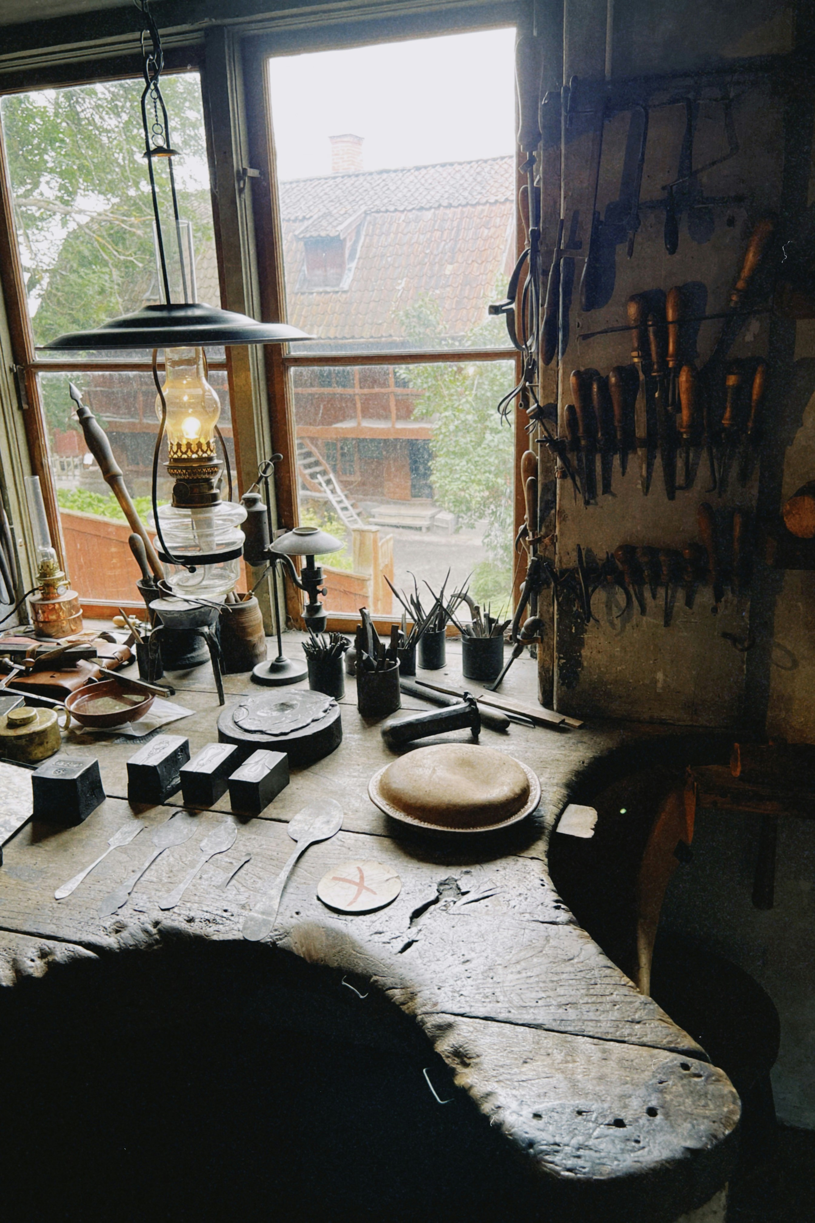 Bench of Craft: A Jeweler's Workshop Framed by Window Light