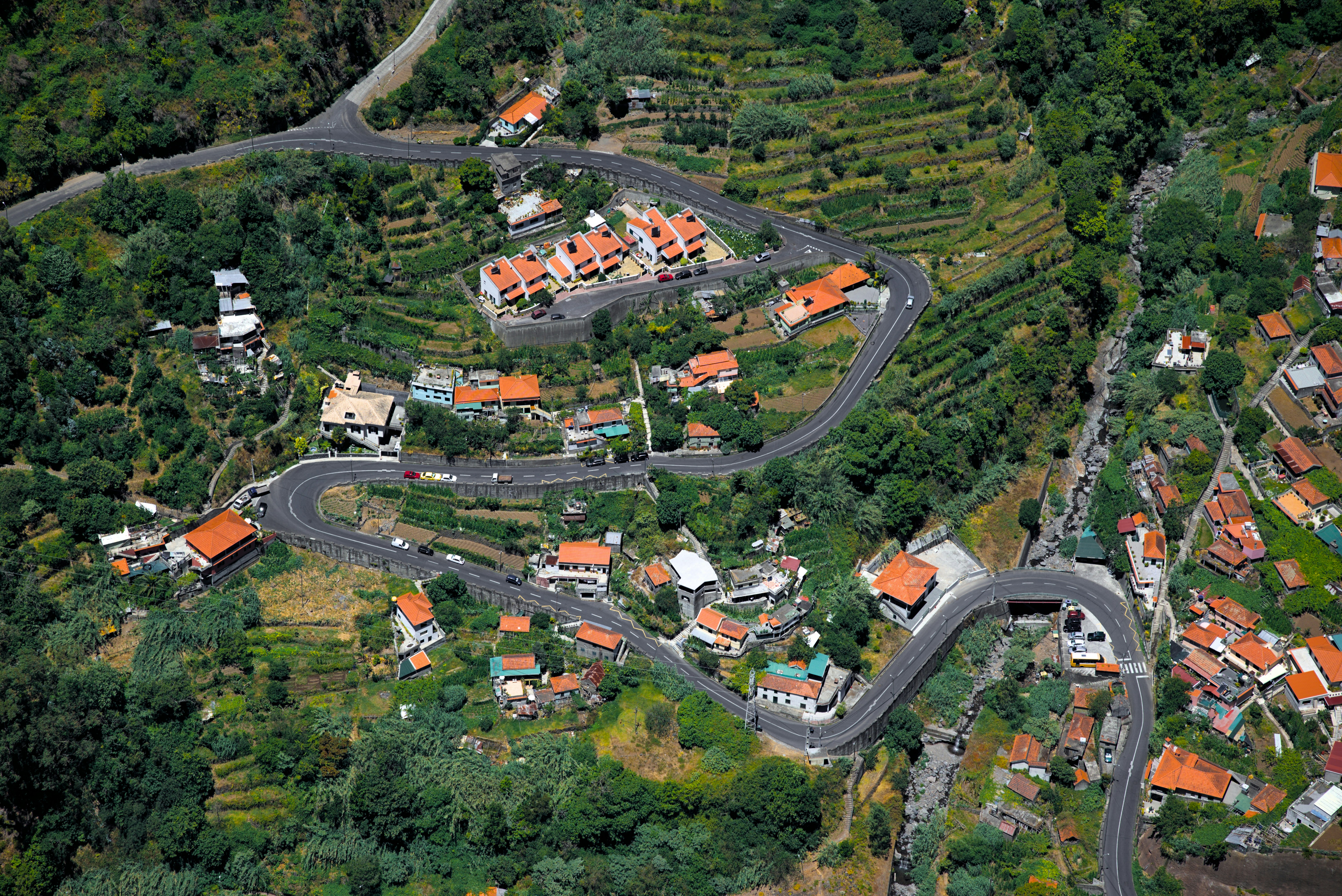 Winding roads and houses nestled in the hills.