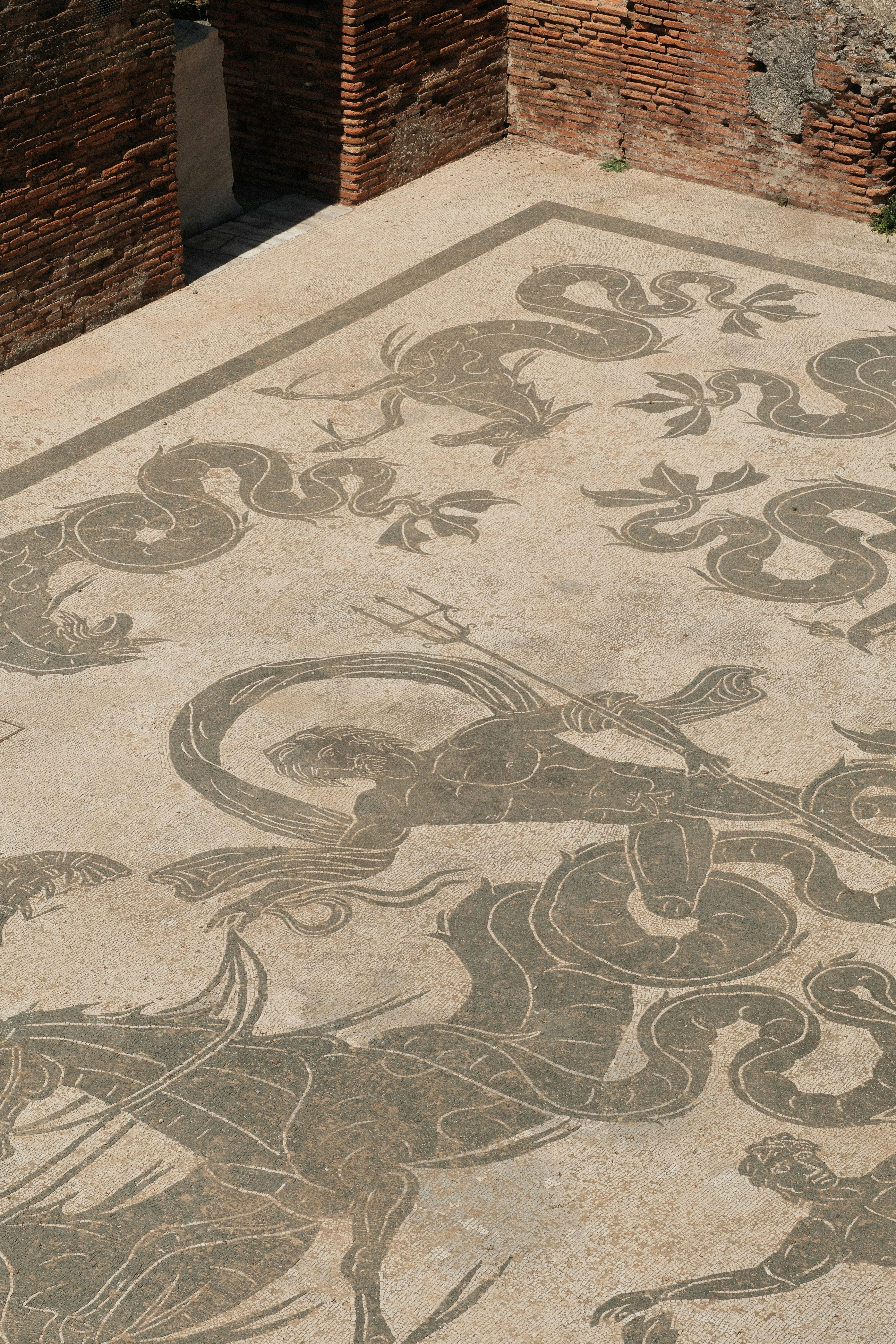 Ancient roman mosaic art adorns the floor.
