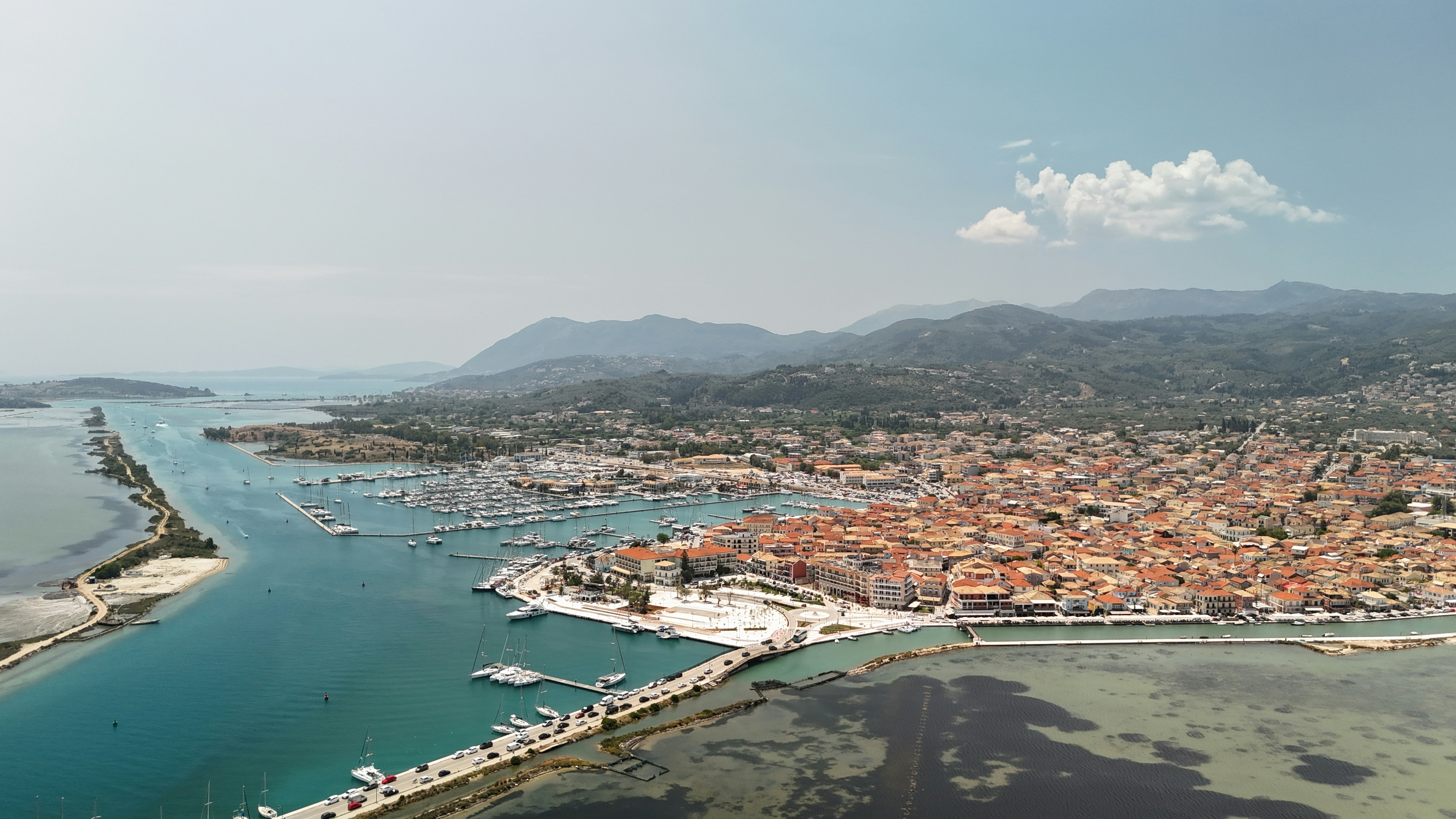 Aerial view of a coastal town with beautiful waters.