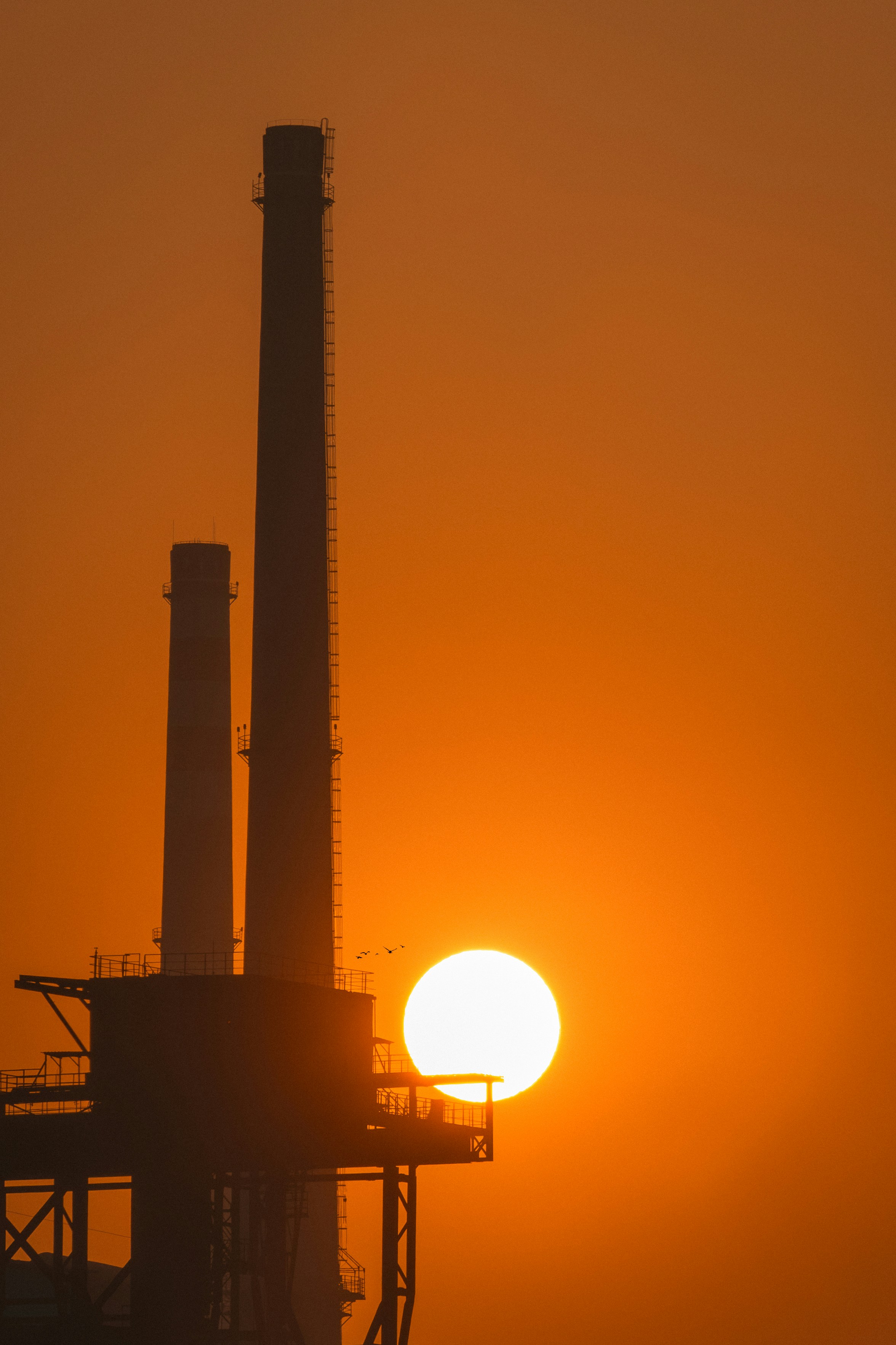 Sunset Silhouettes: The Industrial Horizon
