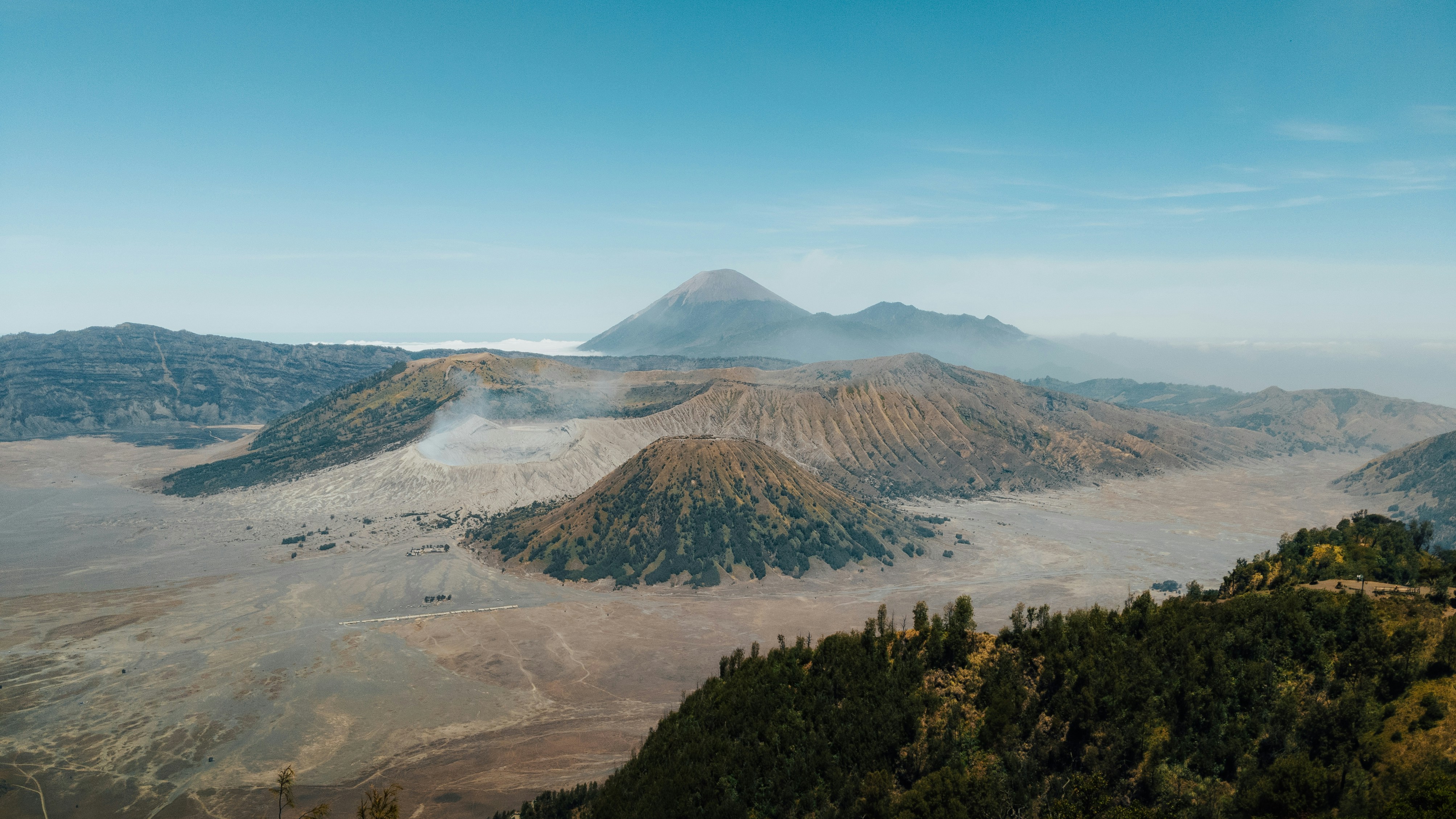 Volcanoes and arid terrain under a clear sky. photo – Free Wallpaper ...