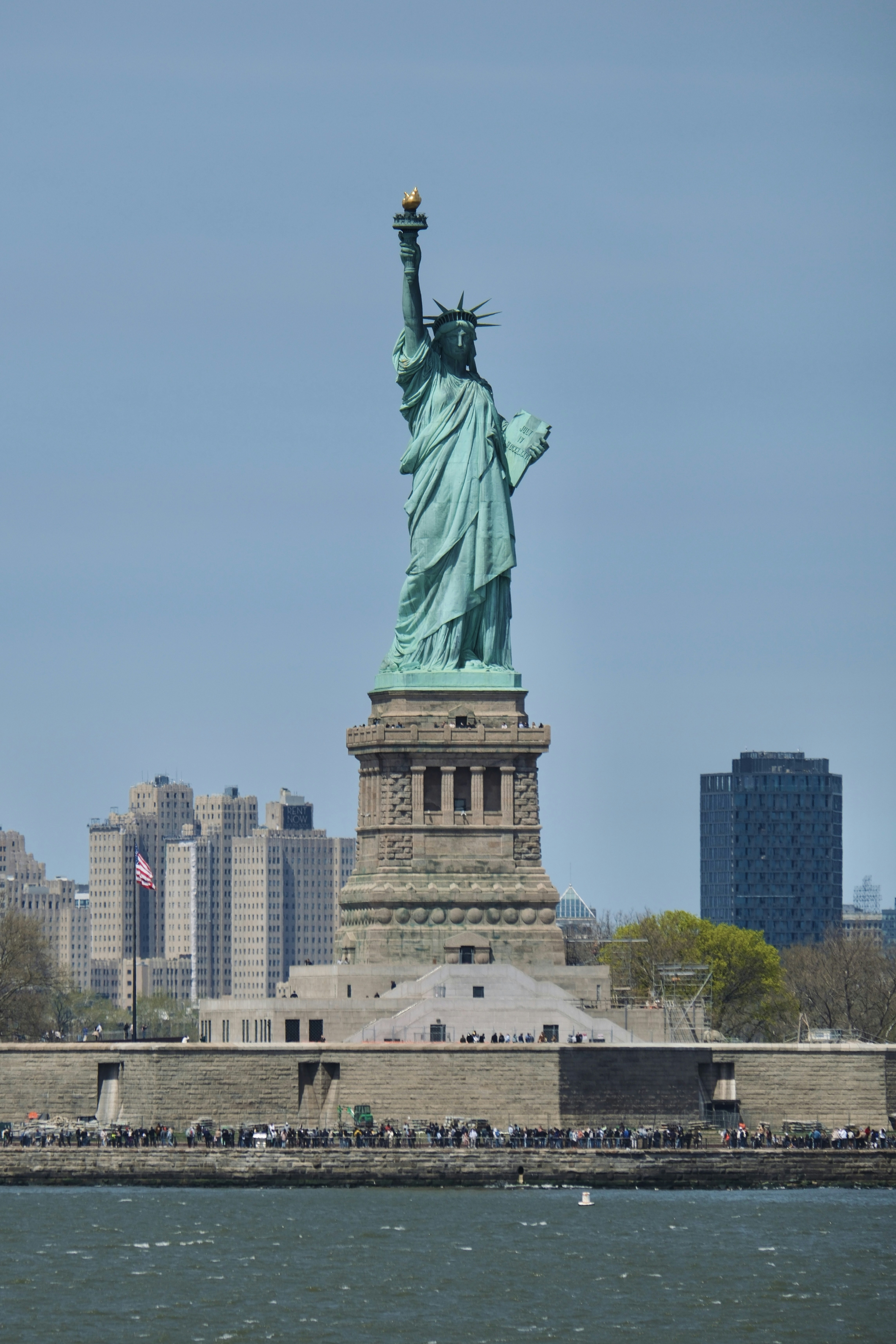 Beacon of Freedom Against the Urban Skyline
