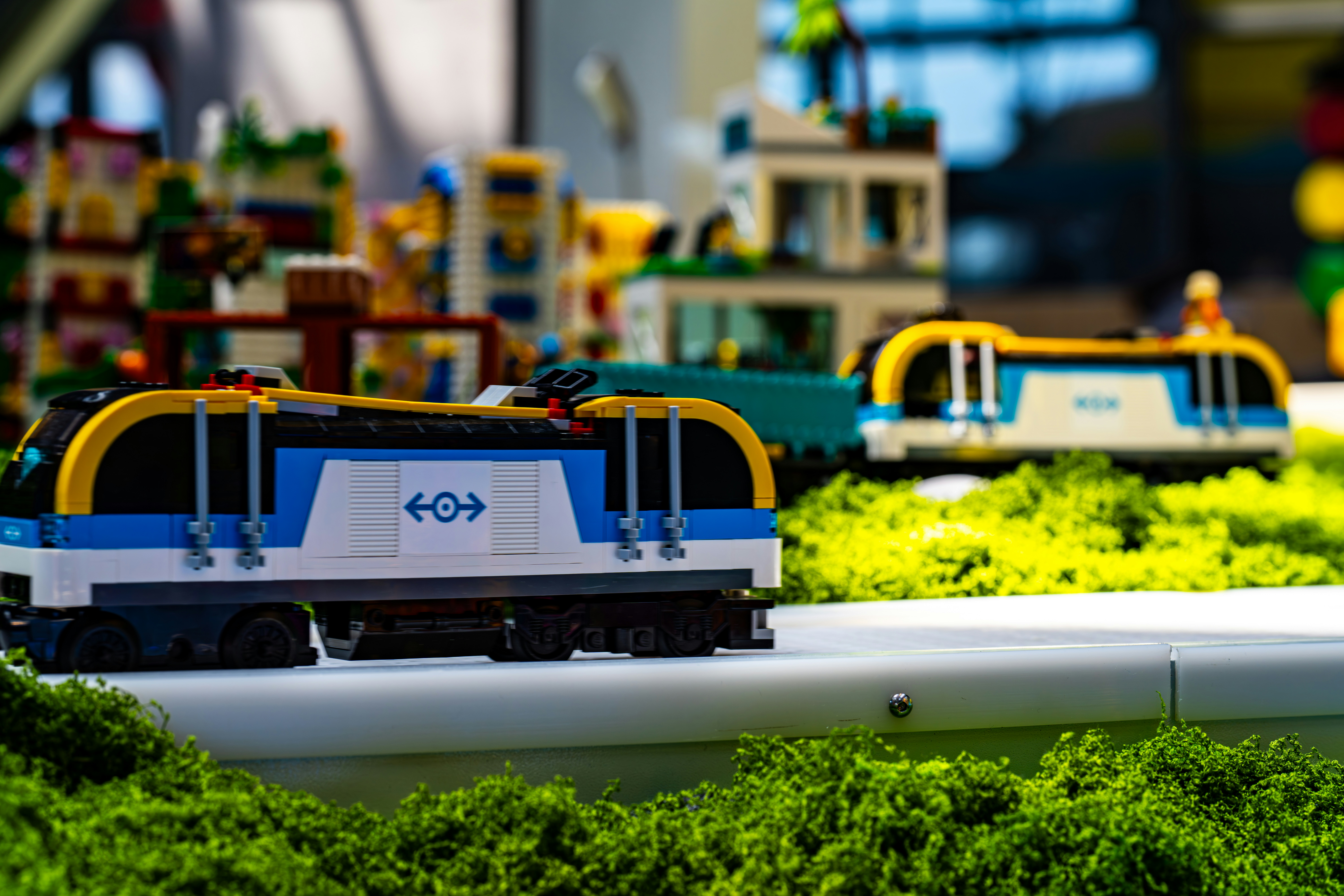 Lego Locomotive Parade on a Lush Miniature Track